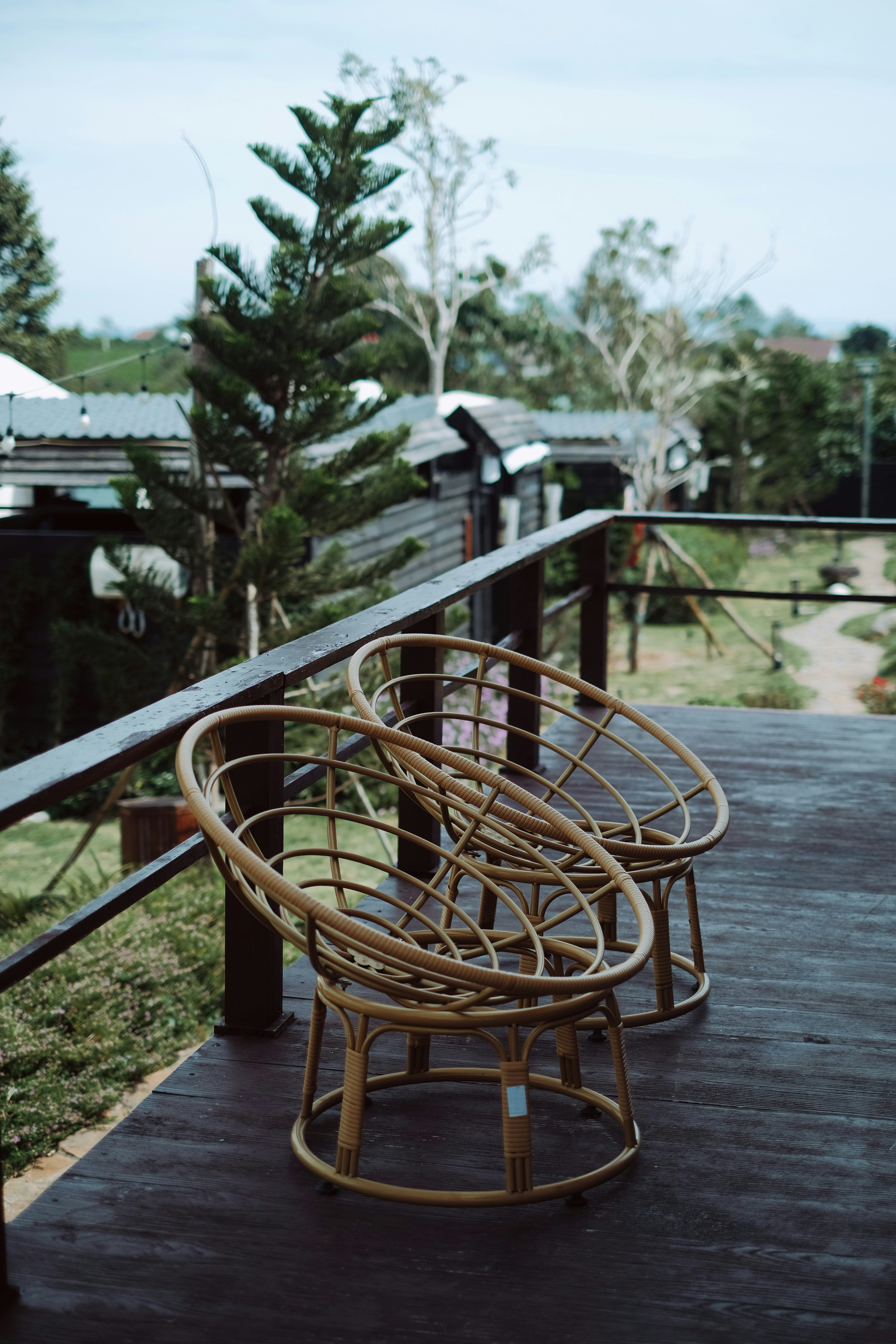 Twilight Terrace: Curved Chairs at Dusk on a Wooden Deck