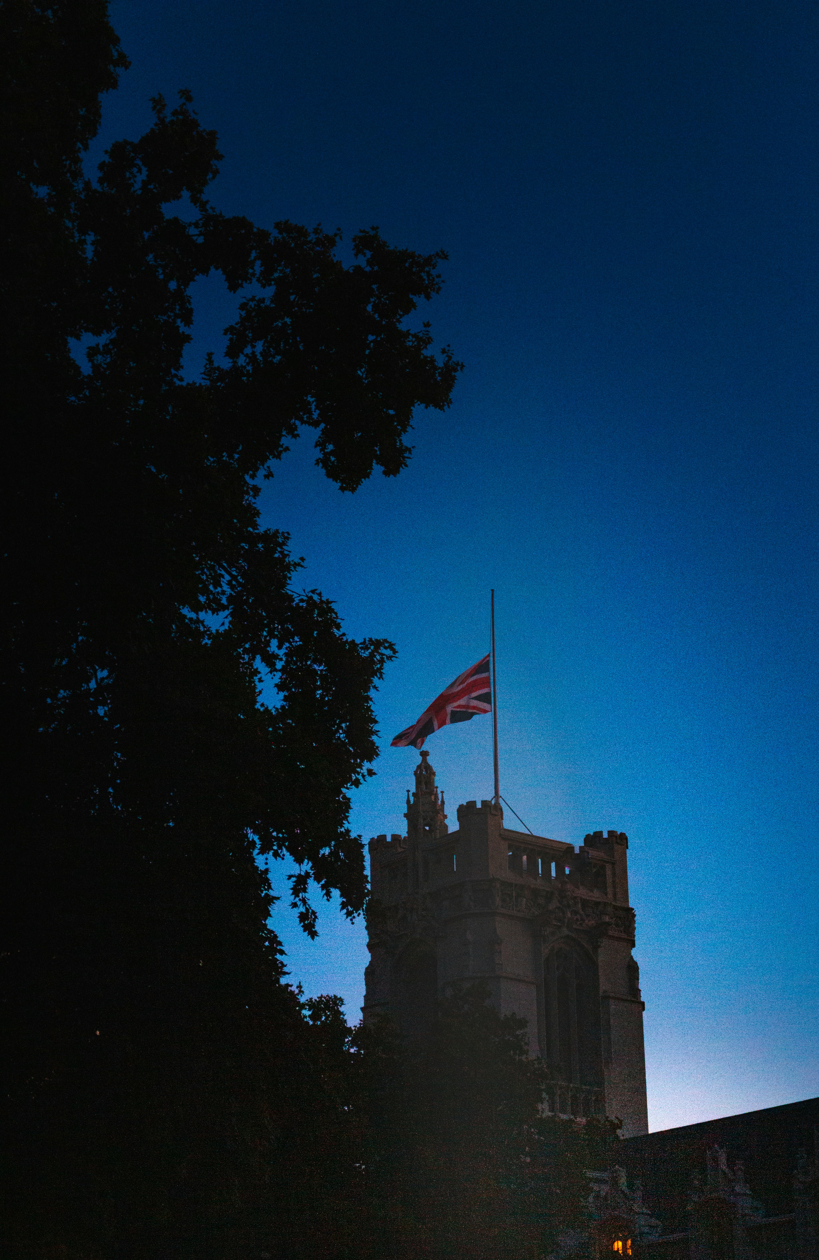 Union Flag at Dusk: Silhouette of a Gothic Tower Beneath a Gradient Sky