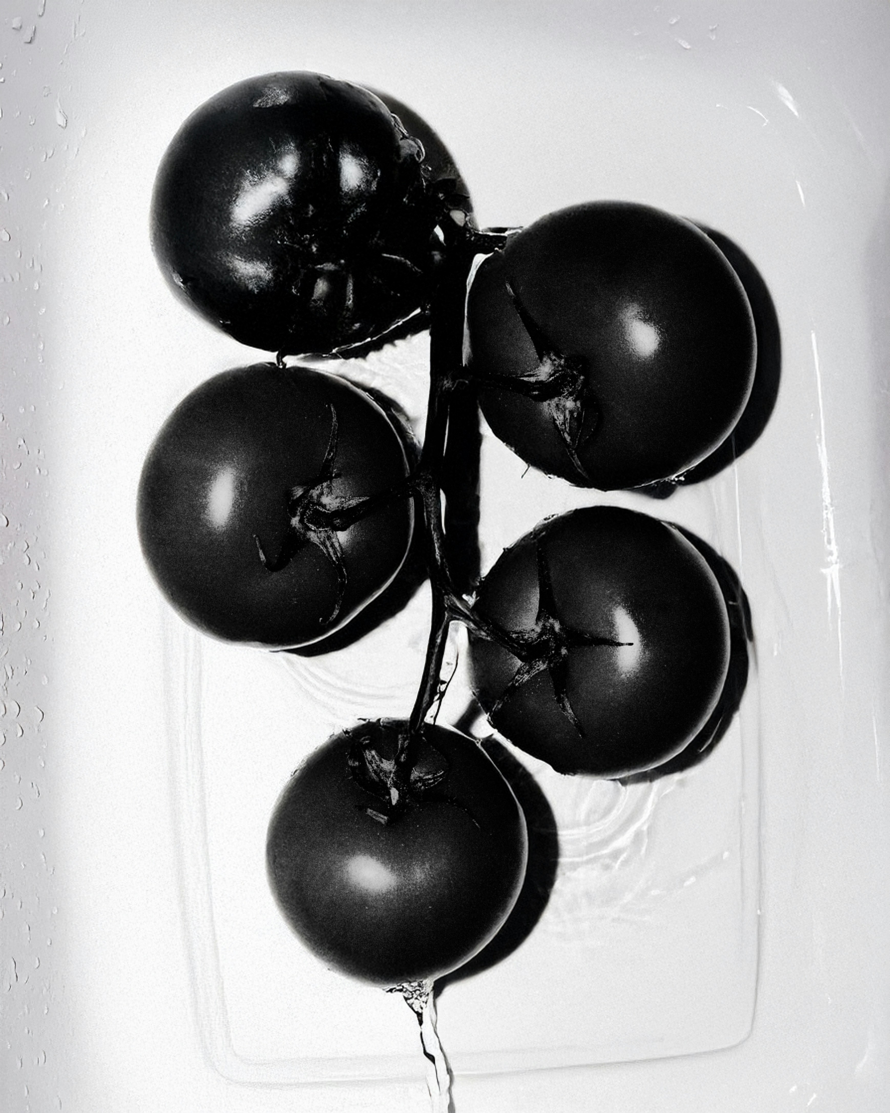Black Grapes in Clear Glass: A Minimal Monochrome Still