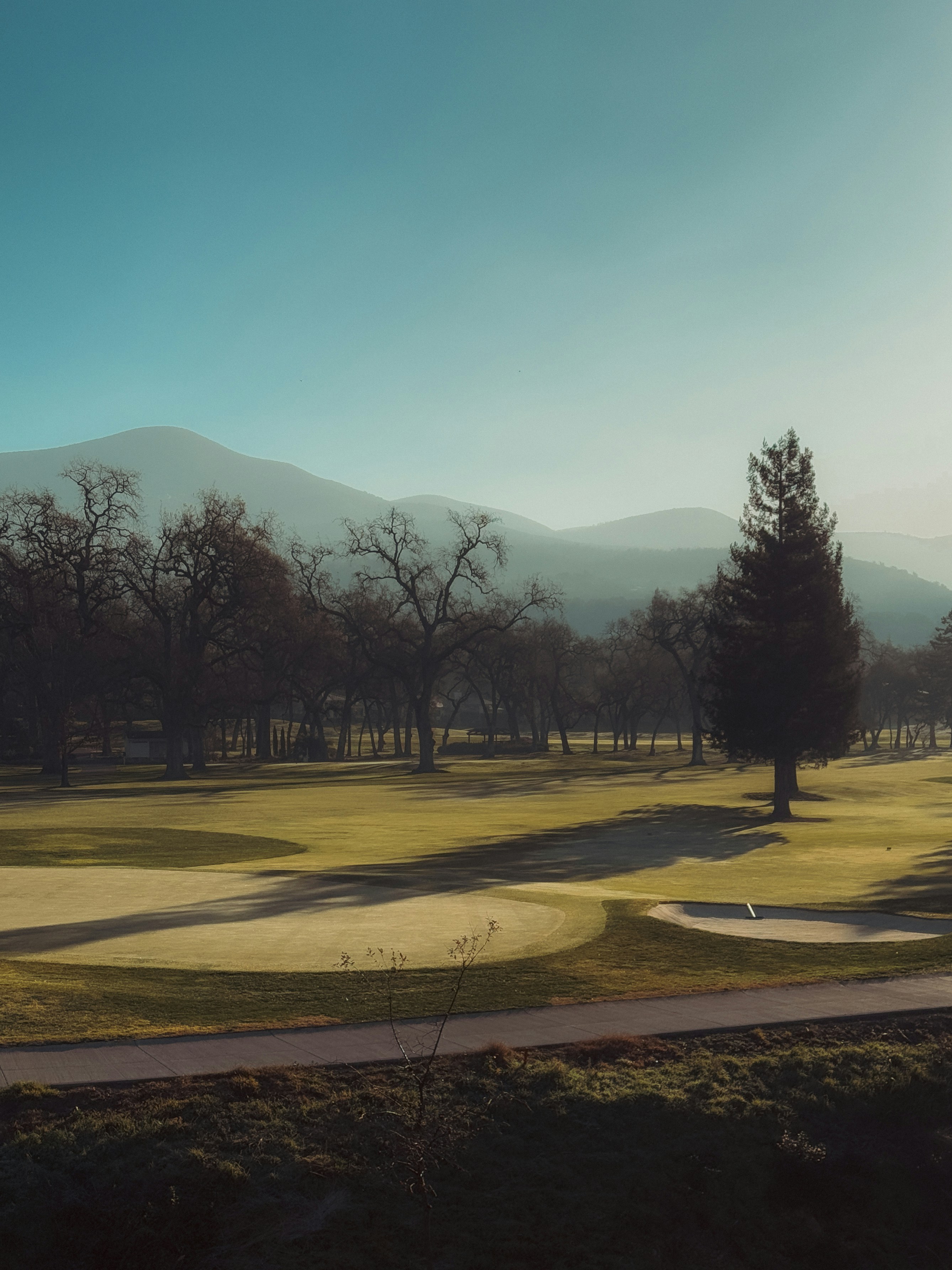 A view of a golf course from the top of a hill photo – Free Napa Image ...