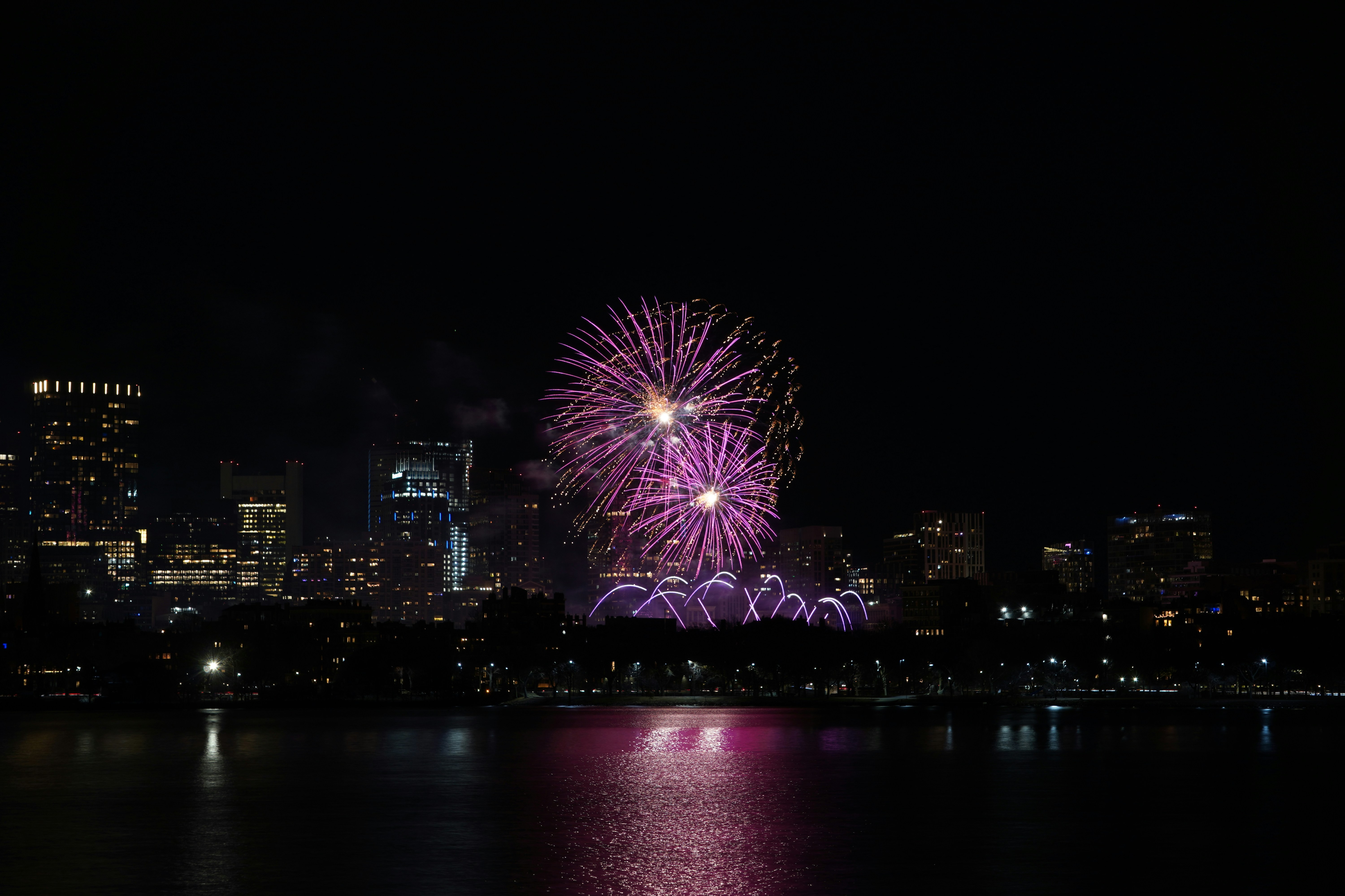 A large fireworks display over a city at night photo – Free Boston ...