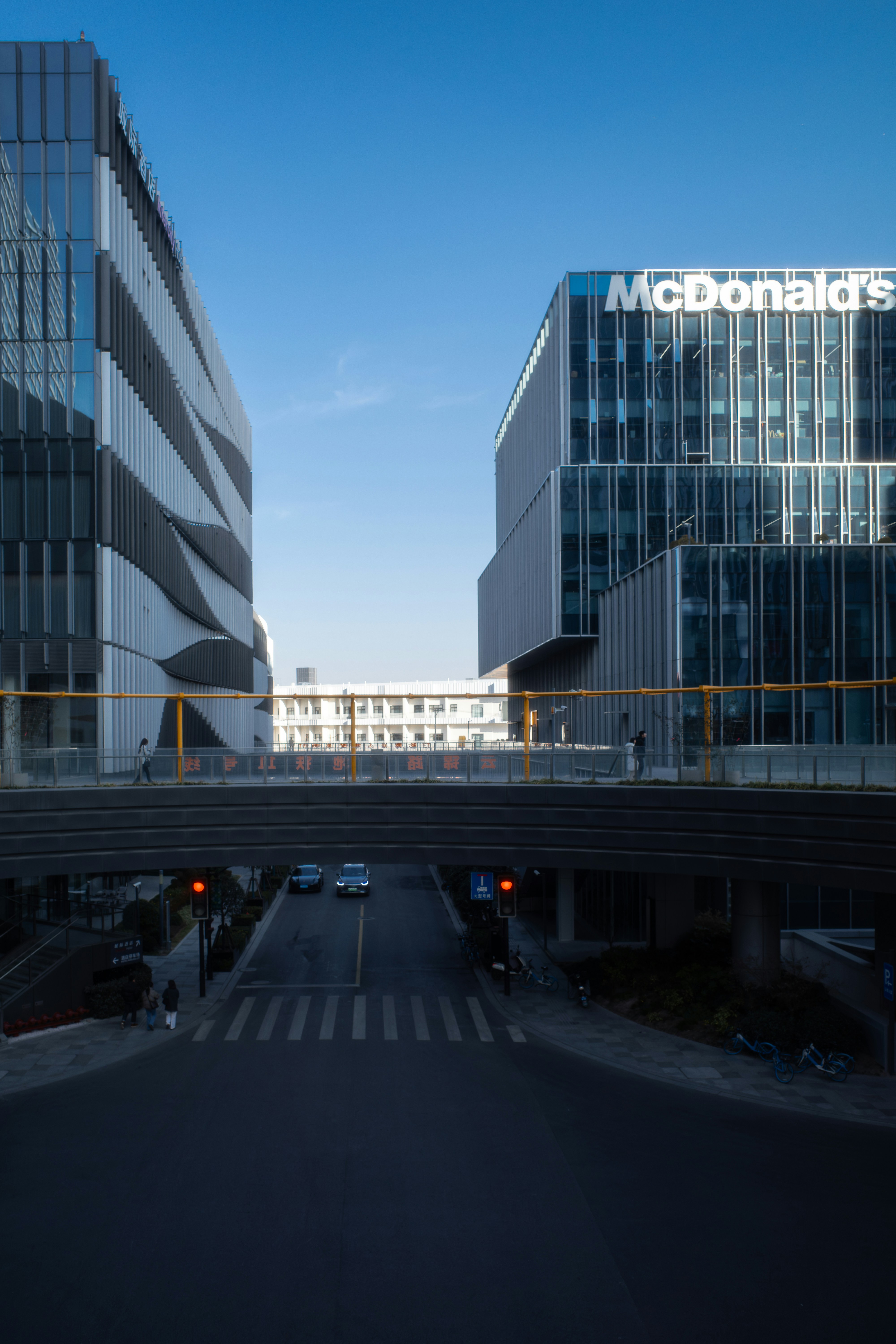 A view of a city street with buildings in the background photo – Free ...