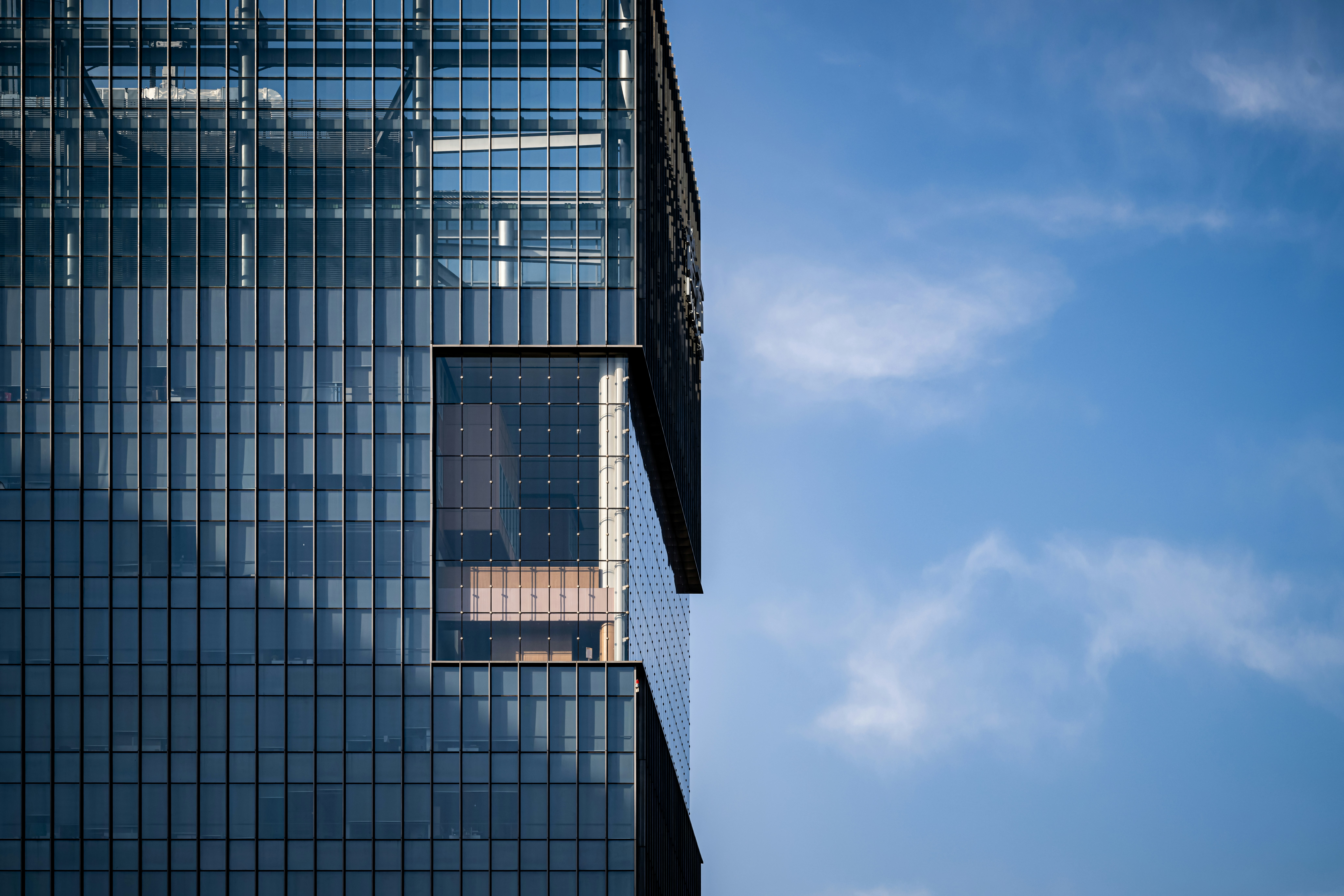 A tall glass building with a sky background photo – Free Xuhui district ...