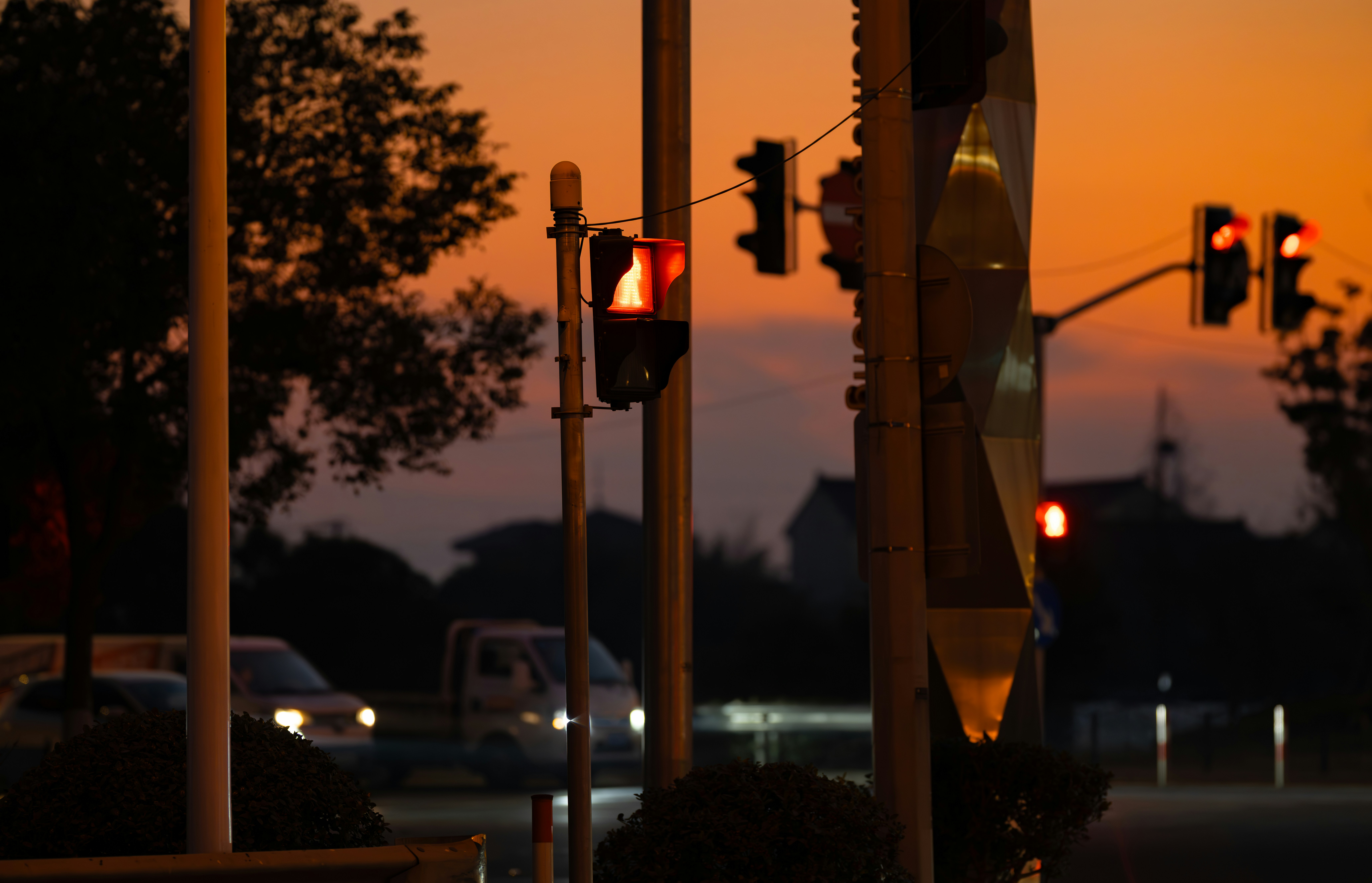 Crimson Signal at Dusk: A Quiet Intersection in Amber Hour