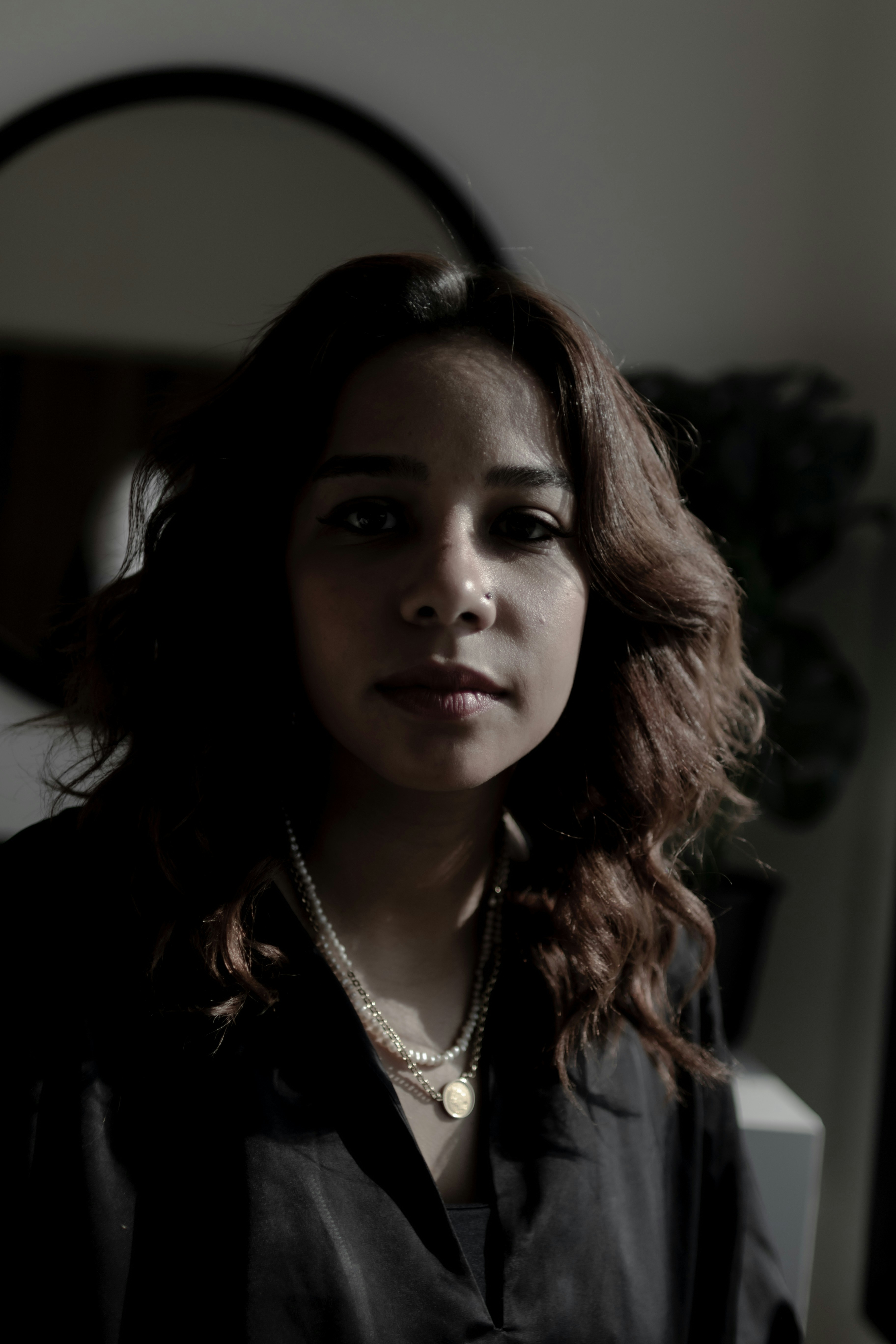 Low-Lit Poise: Portrait of Quiet Confidence in Pearl