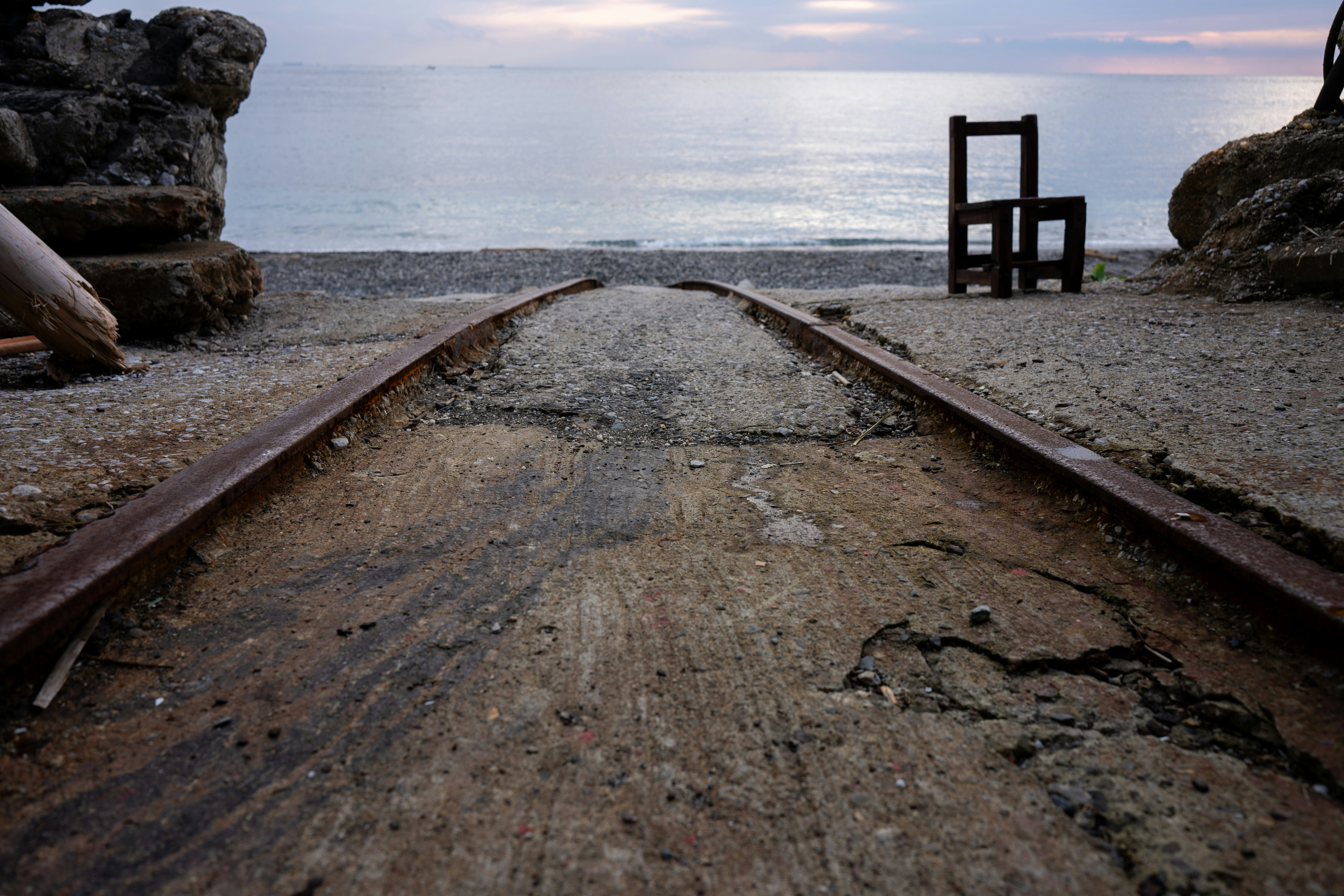 Tracks to the Quiet Sea: A Deserted Beach at Dusk
