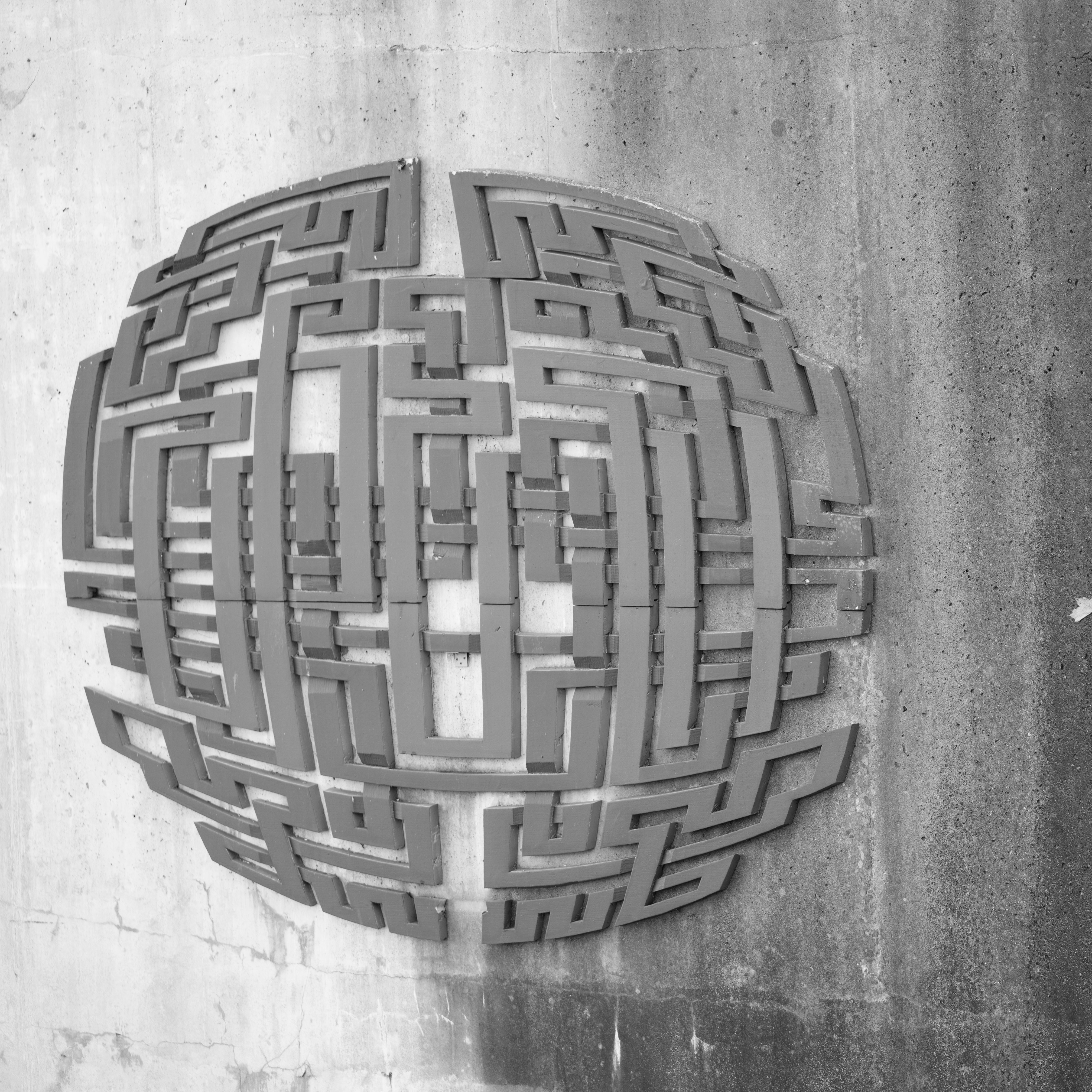 Sphere of Pathways: A Circular Lattice Sculpture on Concrete