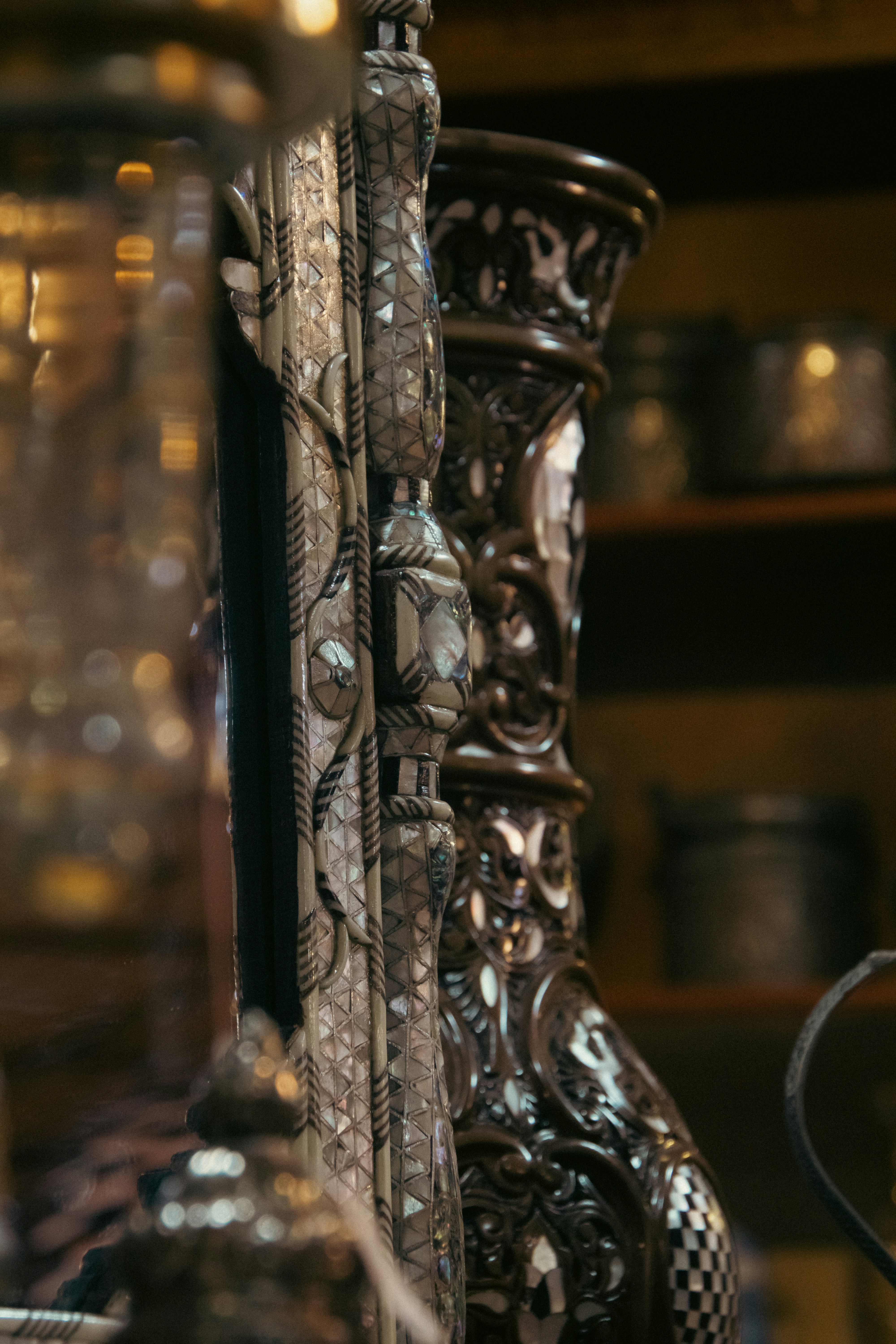 Ornate Baroque Detail: A Row of Engraved Leather Straps Adorning a Vintage Vessel