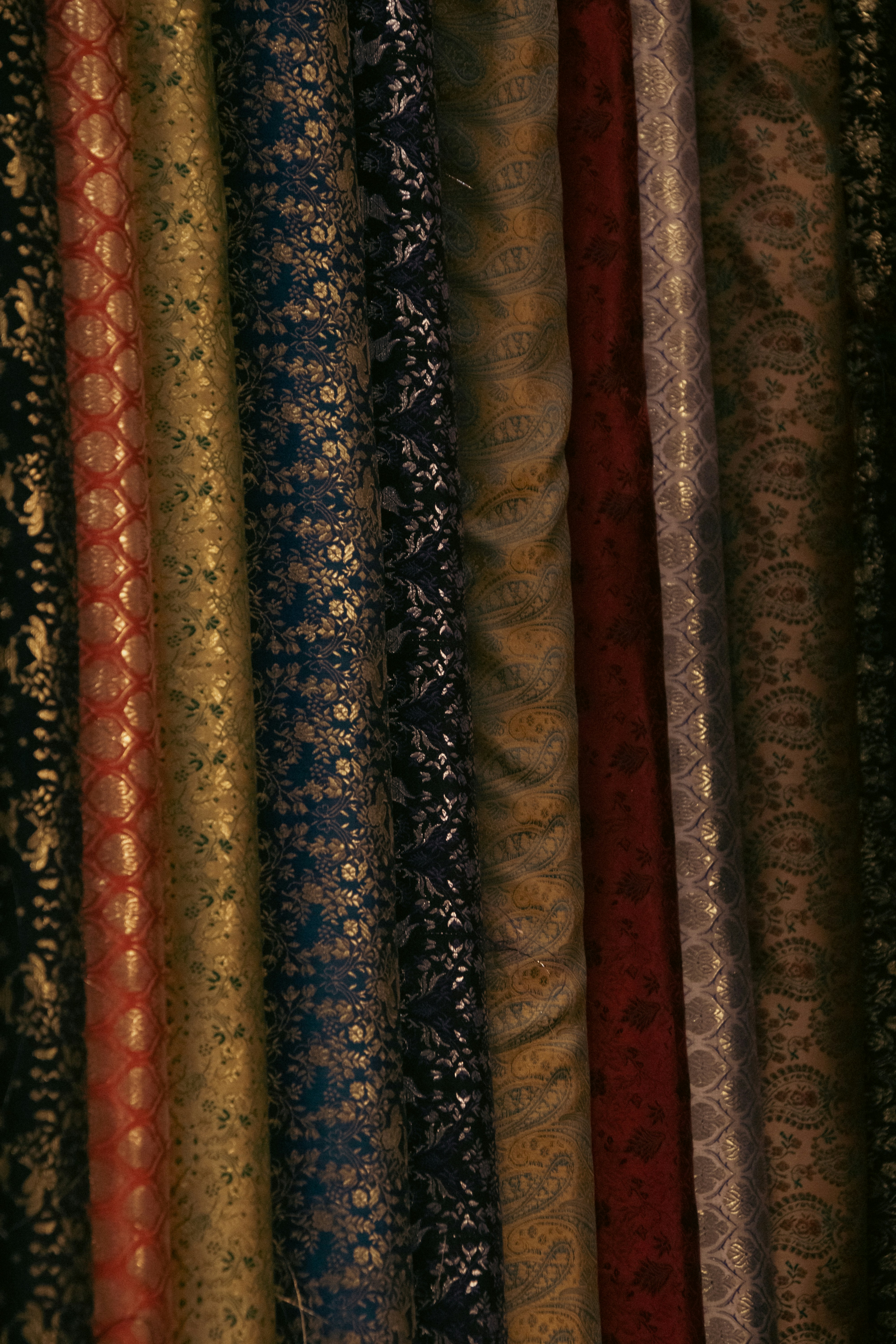 A close up of a bunch of different colored fabrics