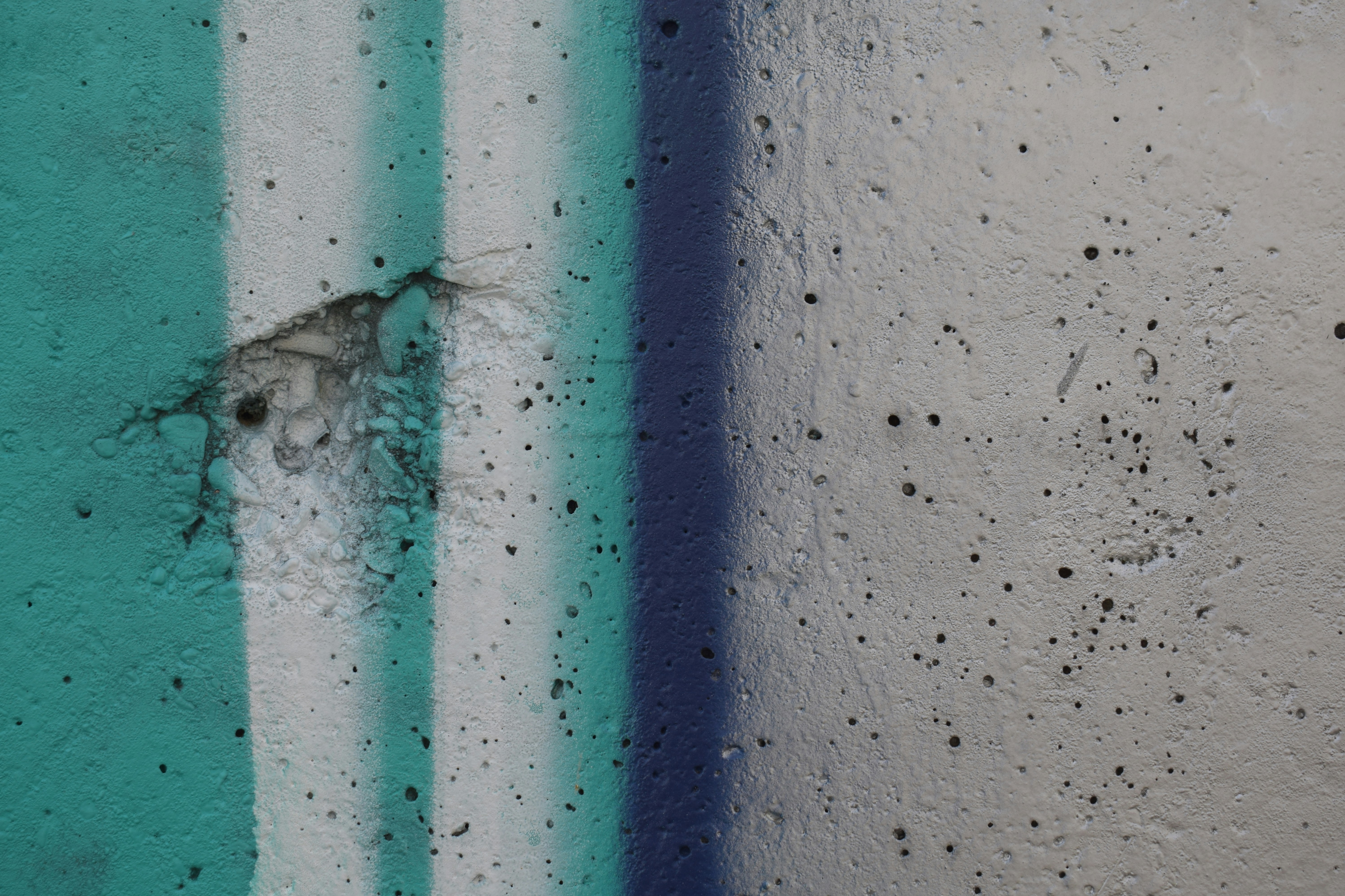 Chipped Concrete Echo Between Turquoise Stripes