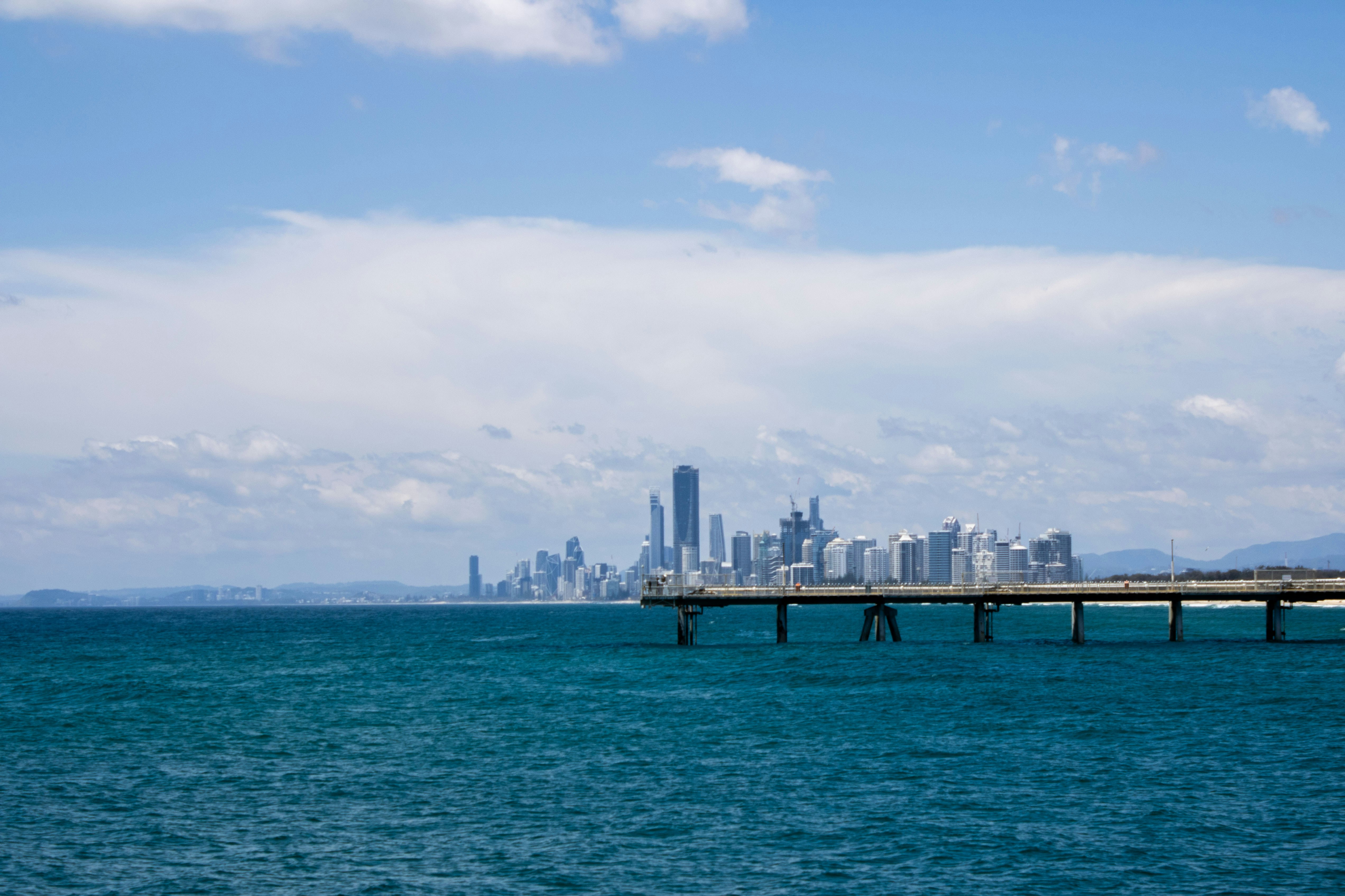 A large body of water with a city in the background
