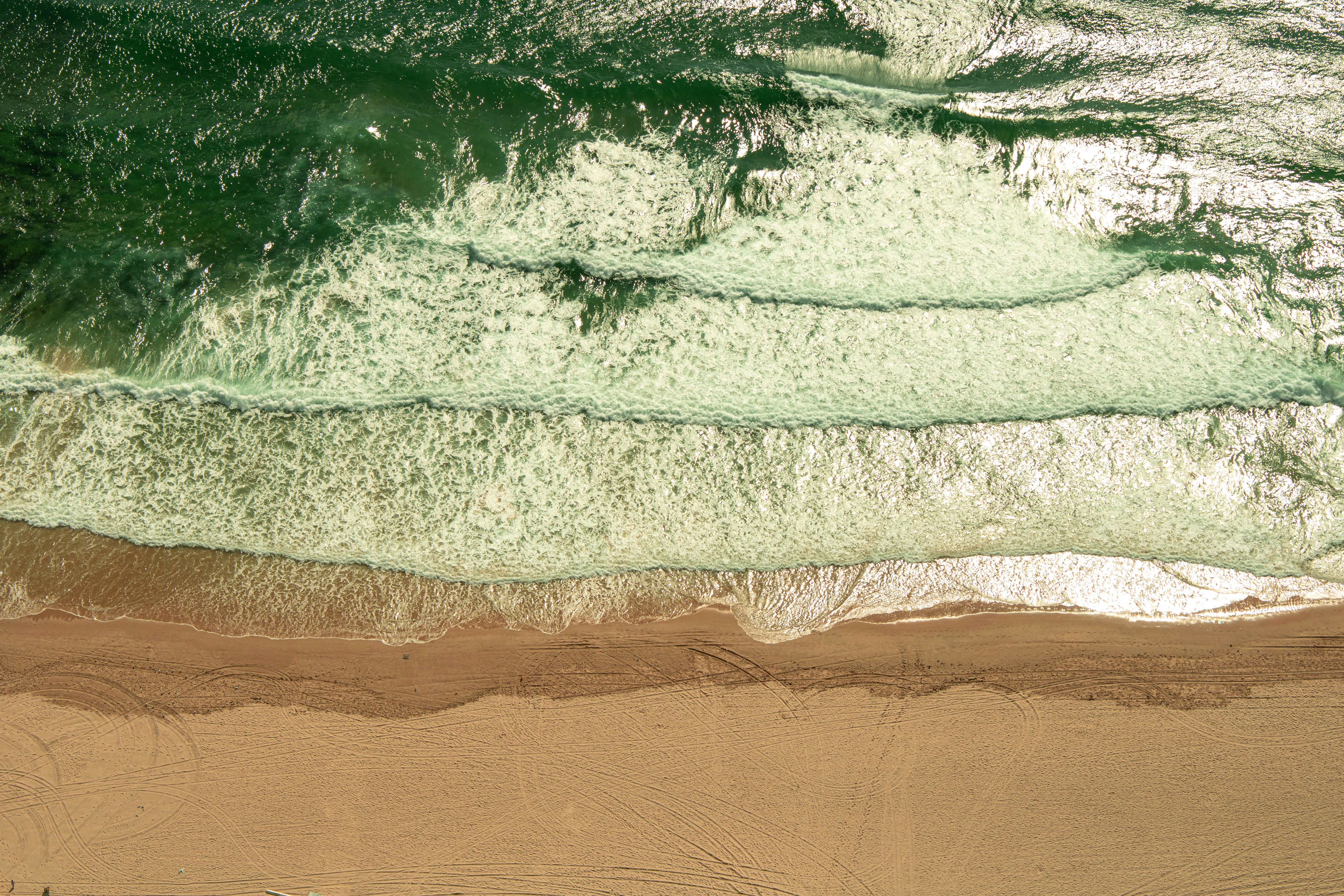 Foam Ridge at the Edge: Aerial Study of Sea and Sand