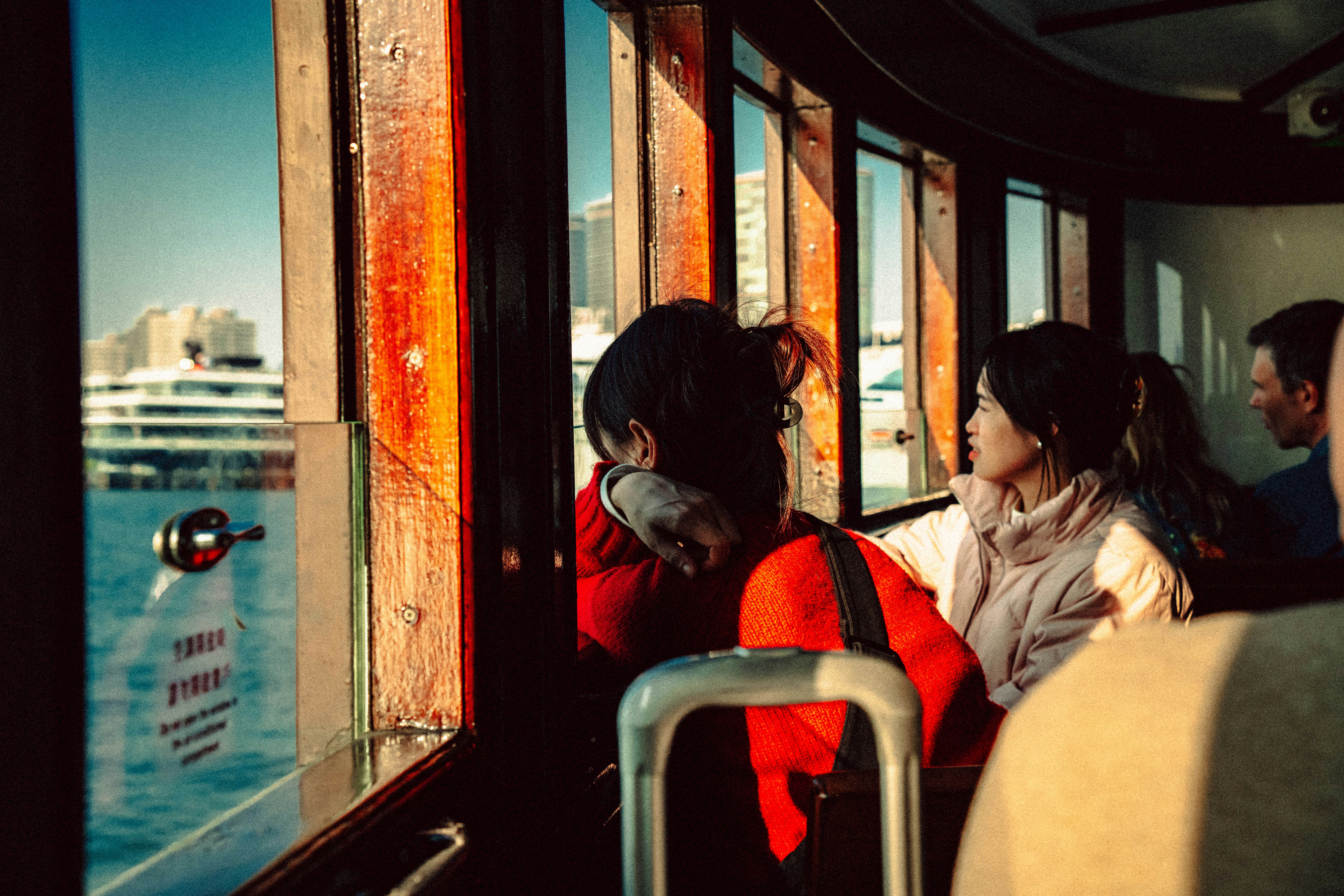 Harbor Light Framing a Quiet Ferry Moment