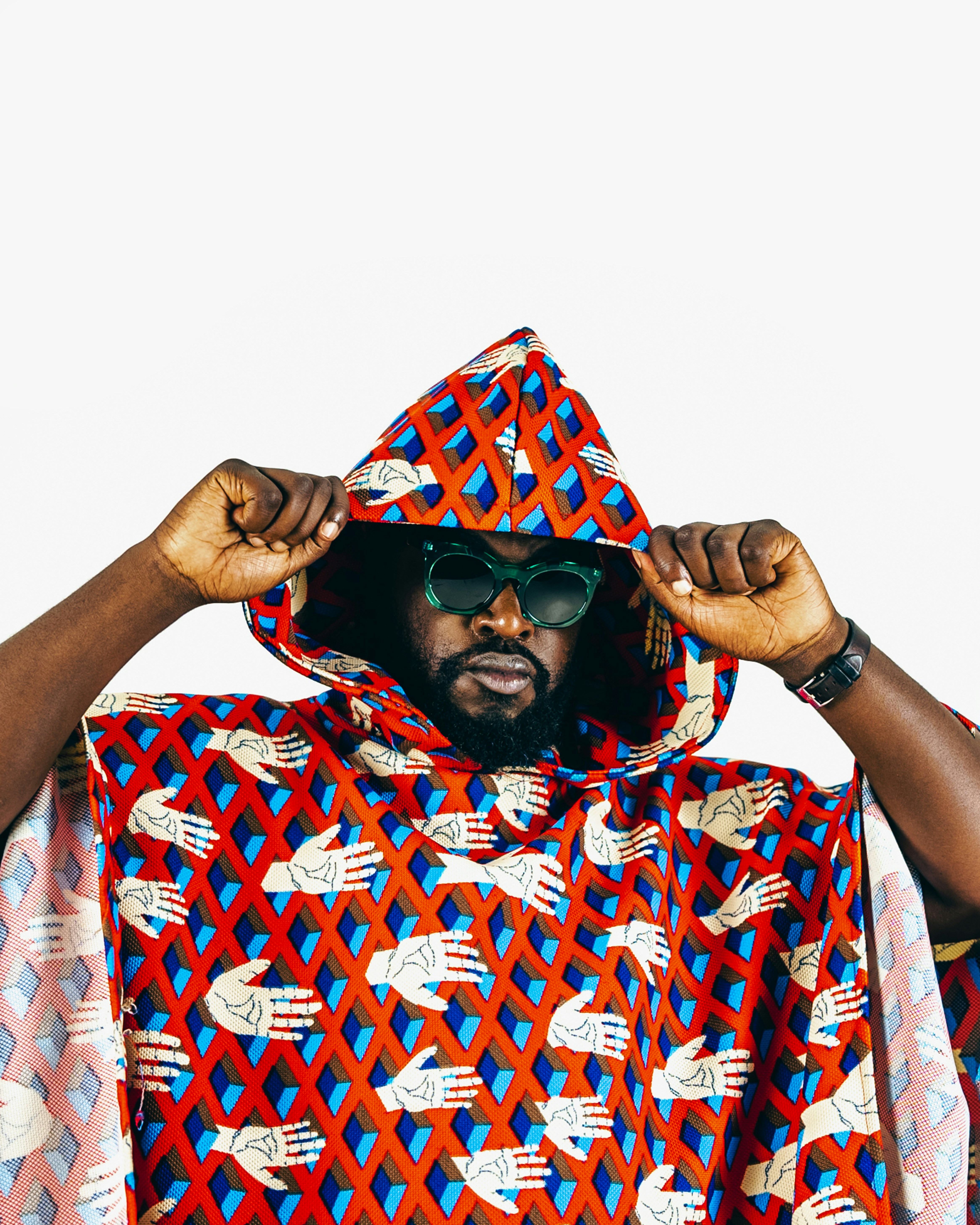 A man in a red and blue patterned cape photo – Free Man Image on Unsplash