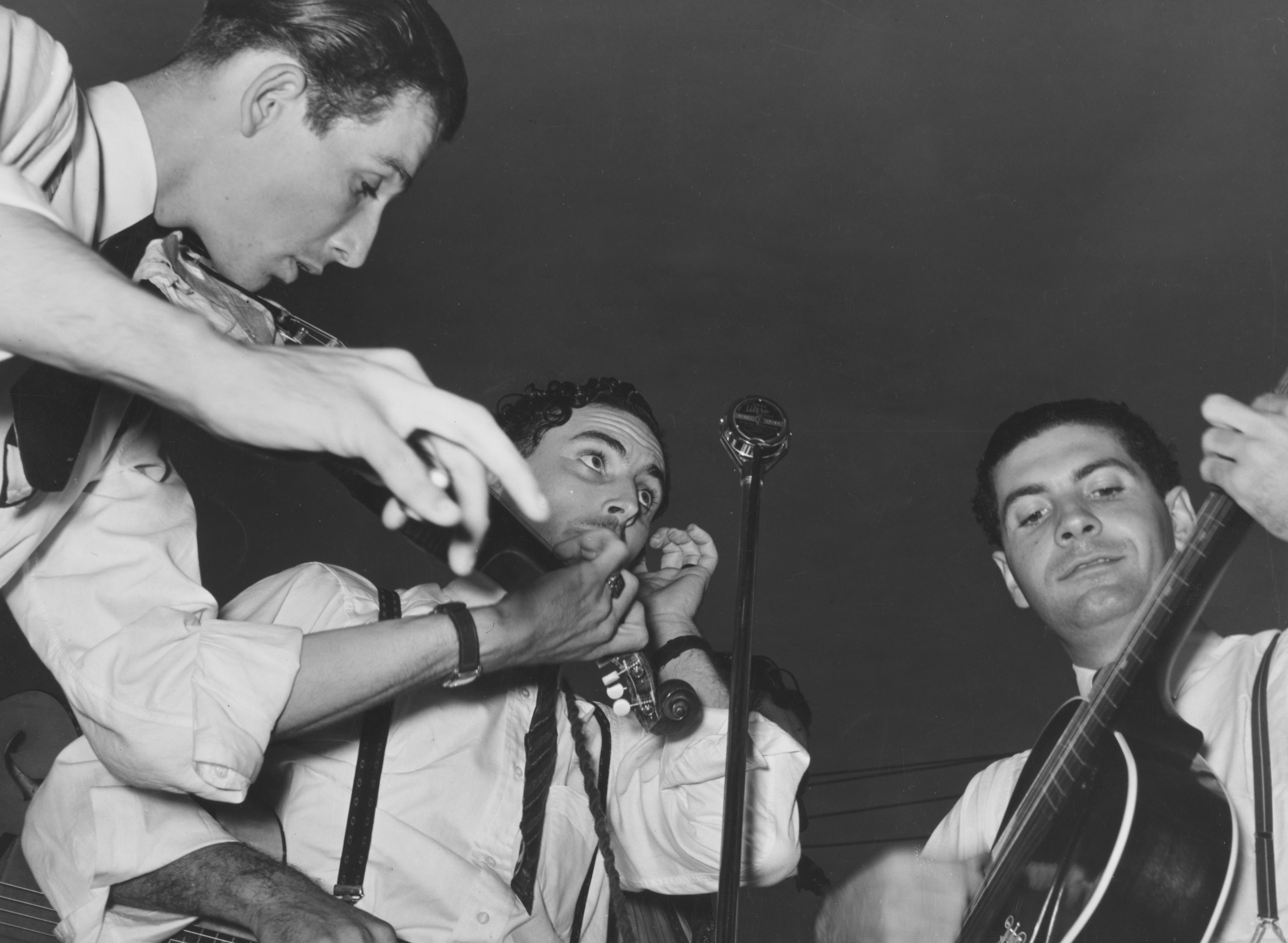 The Miriam and Ira D. Wallach Division of Art, Prints and Photographs: Photography Collection, The New York Public Library. "Musicians in cajun band contest at National Rice Festival. Crowley, Louisiana" The New York Public Library Digital Collections. 1938. https://digitalcollections.nypl.org/items/cd9310b0-0568-0137-6d56-0a99e8d03573