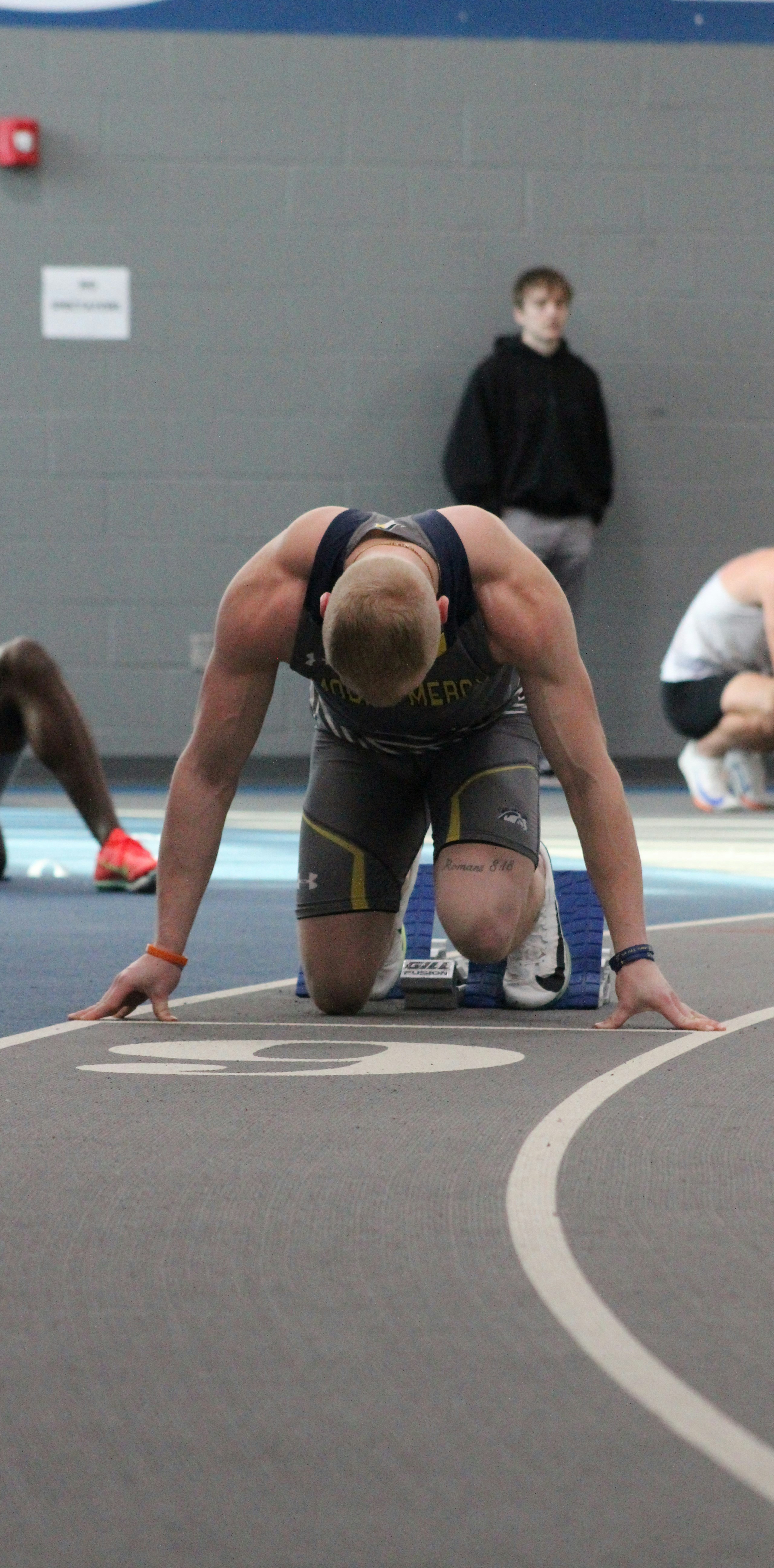 A man is doing a handstand on a race track photo – Free Man Image on ...