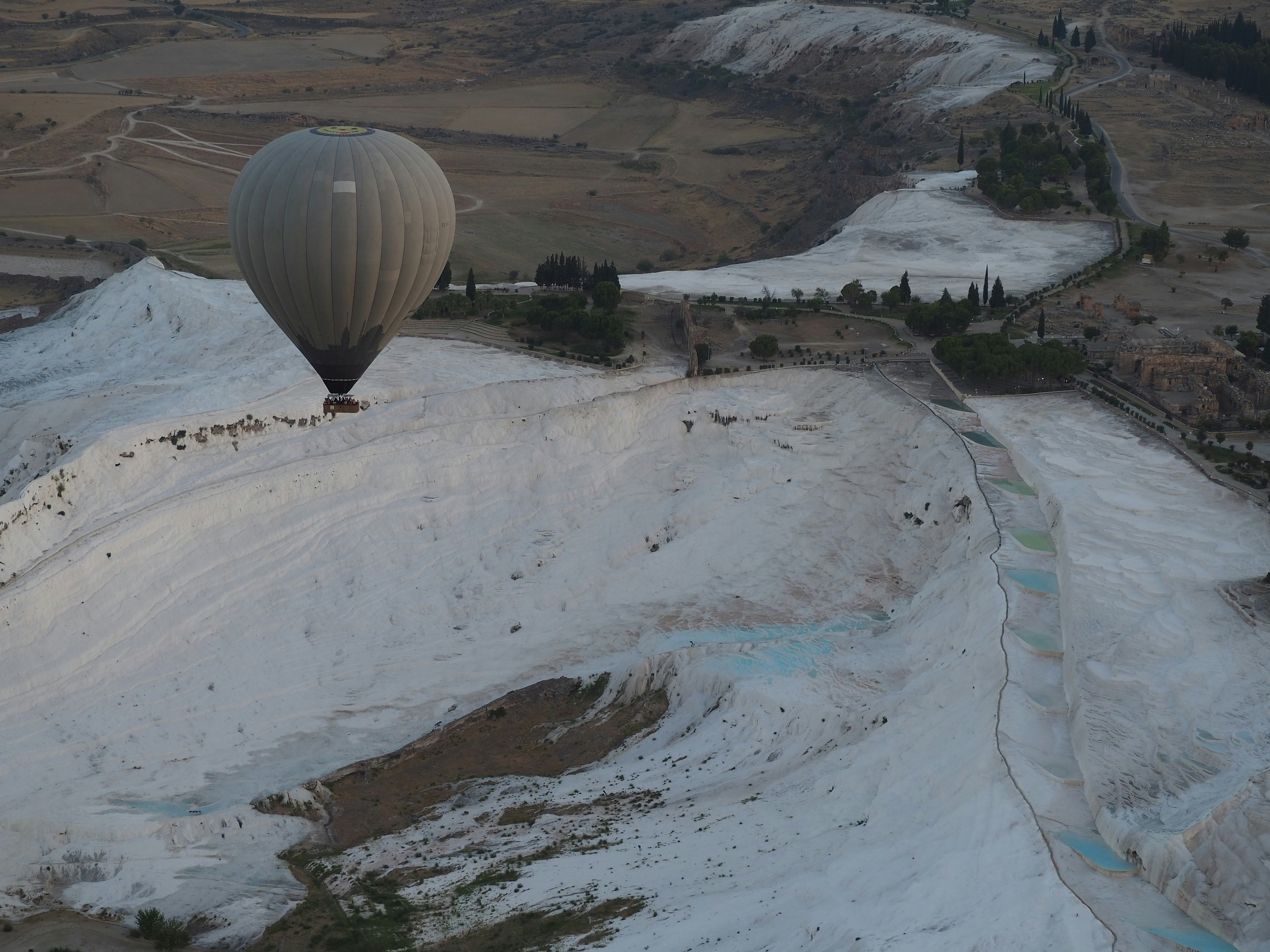 Dusk Flight Over Pamukkale's Alabaster Terraces