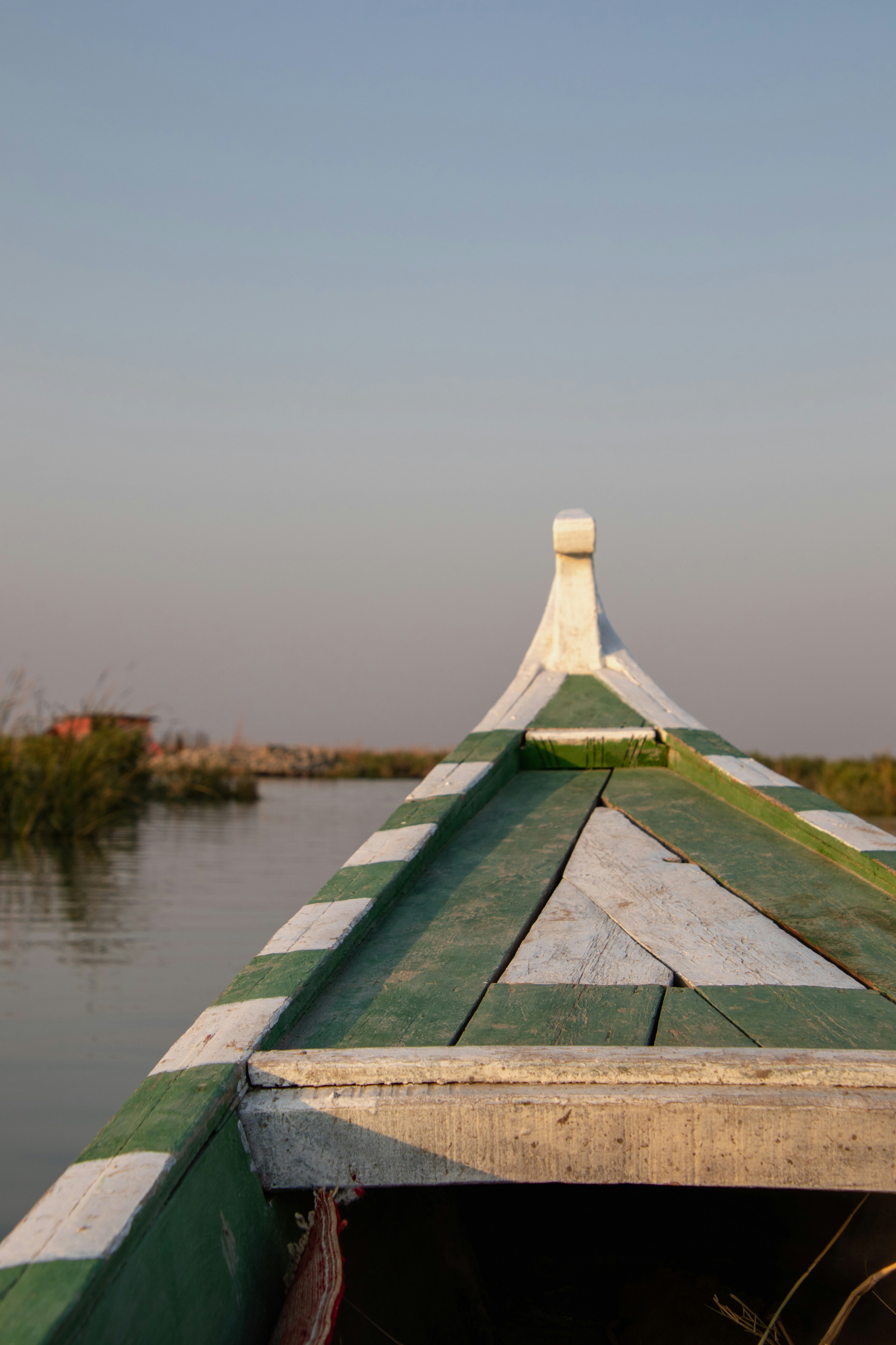 Green-Trimmed Bow Pointing Toward a Quiet Glassy Horizon