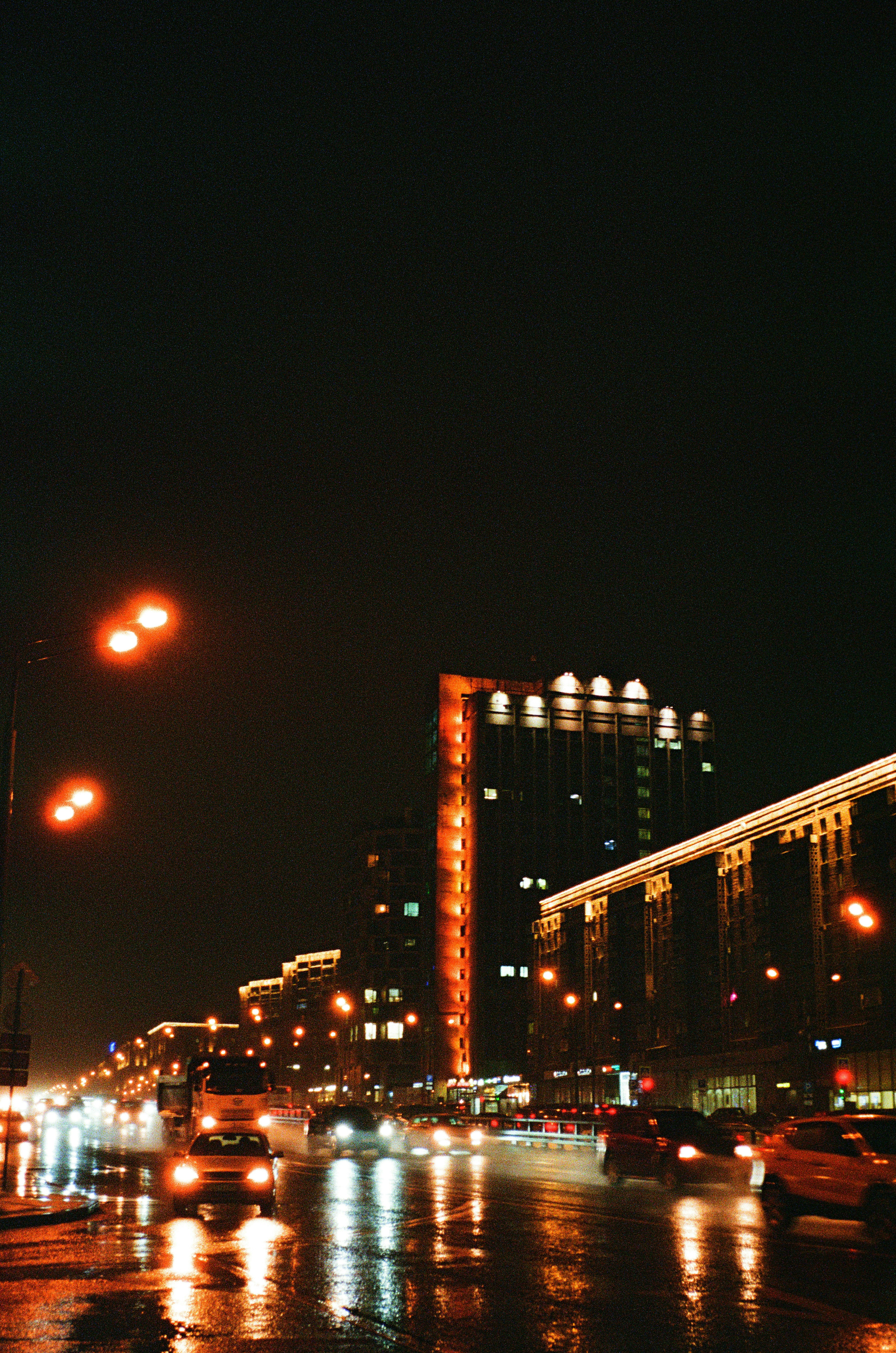 A city street at night with a lot of traffic photo – Free Film Image on ...