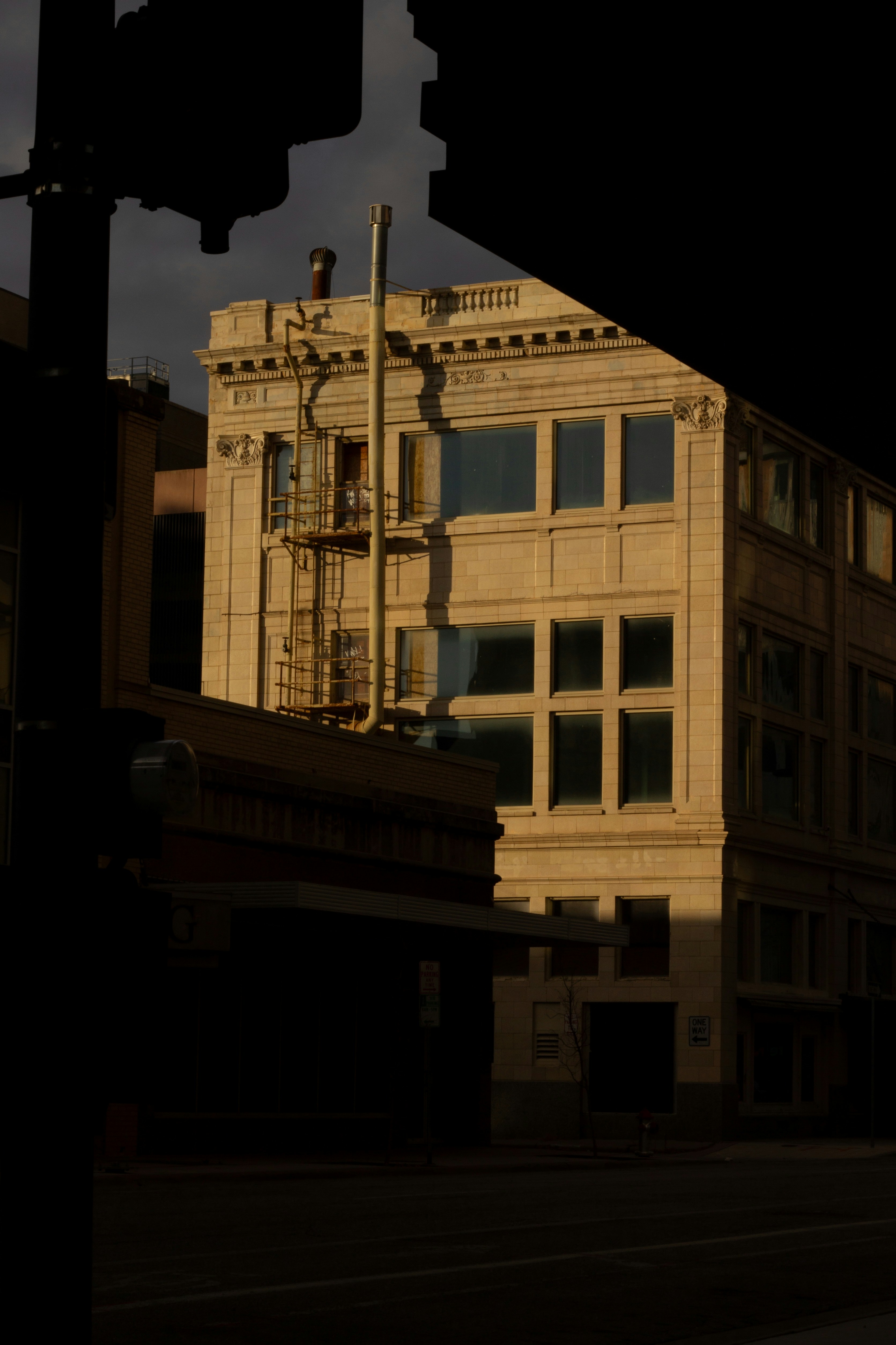 Golden Facade in Shadowed Cityscape