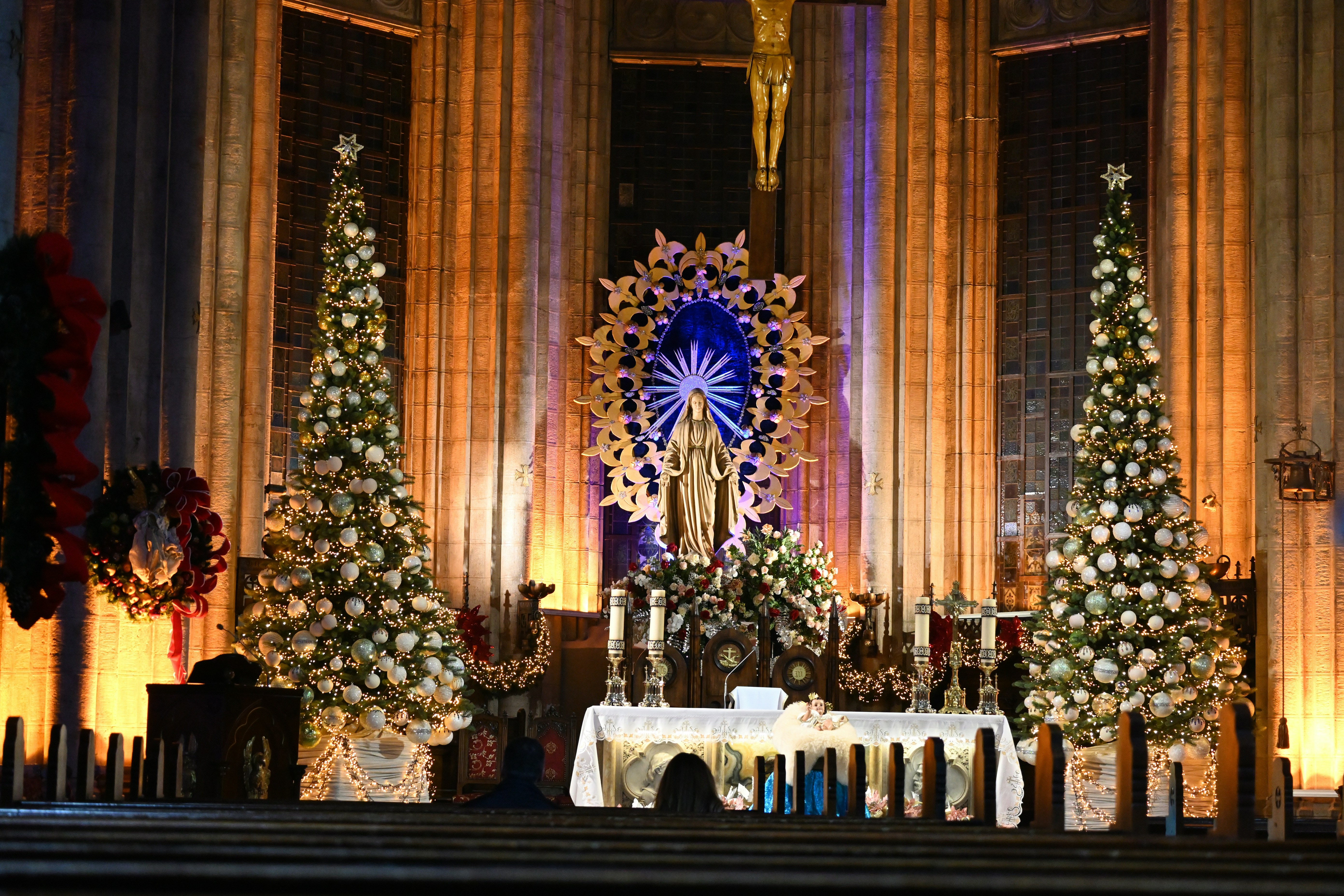 Golden Halo Beneath Winter Light: Christmas Altar in an Ornate Cathedral