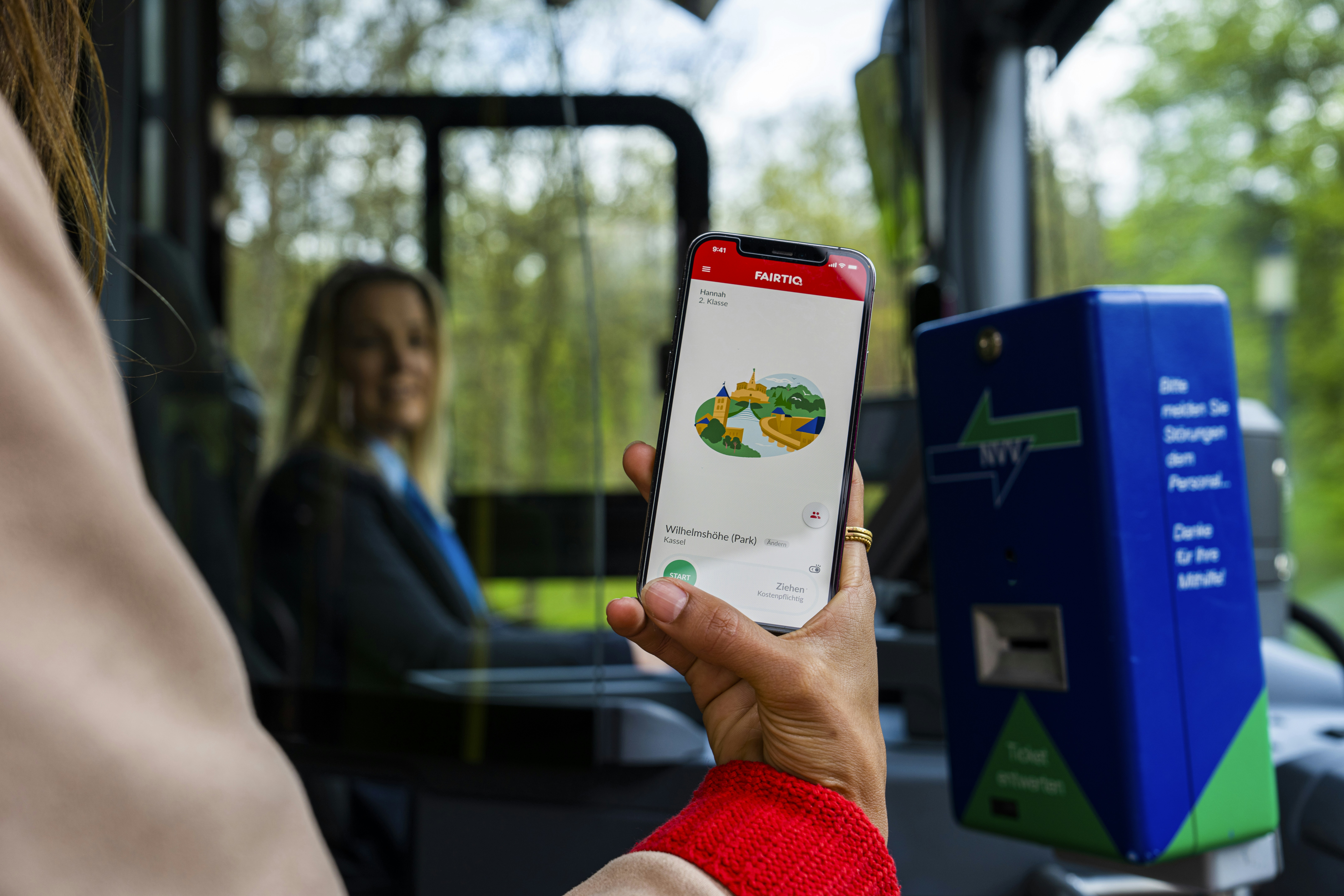 Glow of Navigation: A Commuter's Phone Illuminates a Transit Stop
