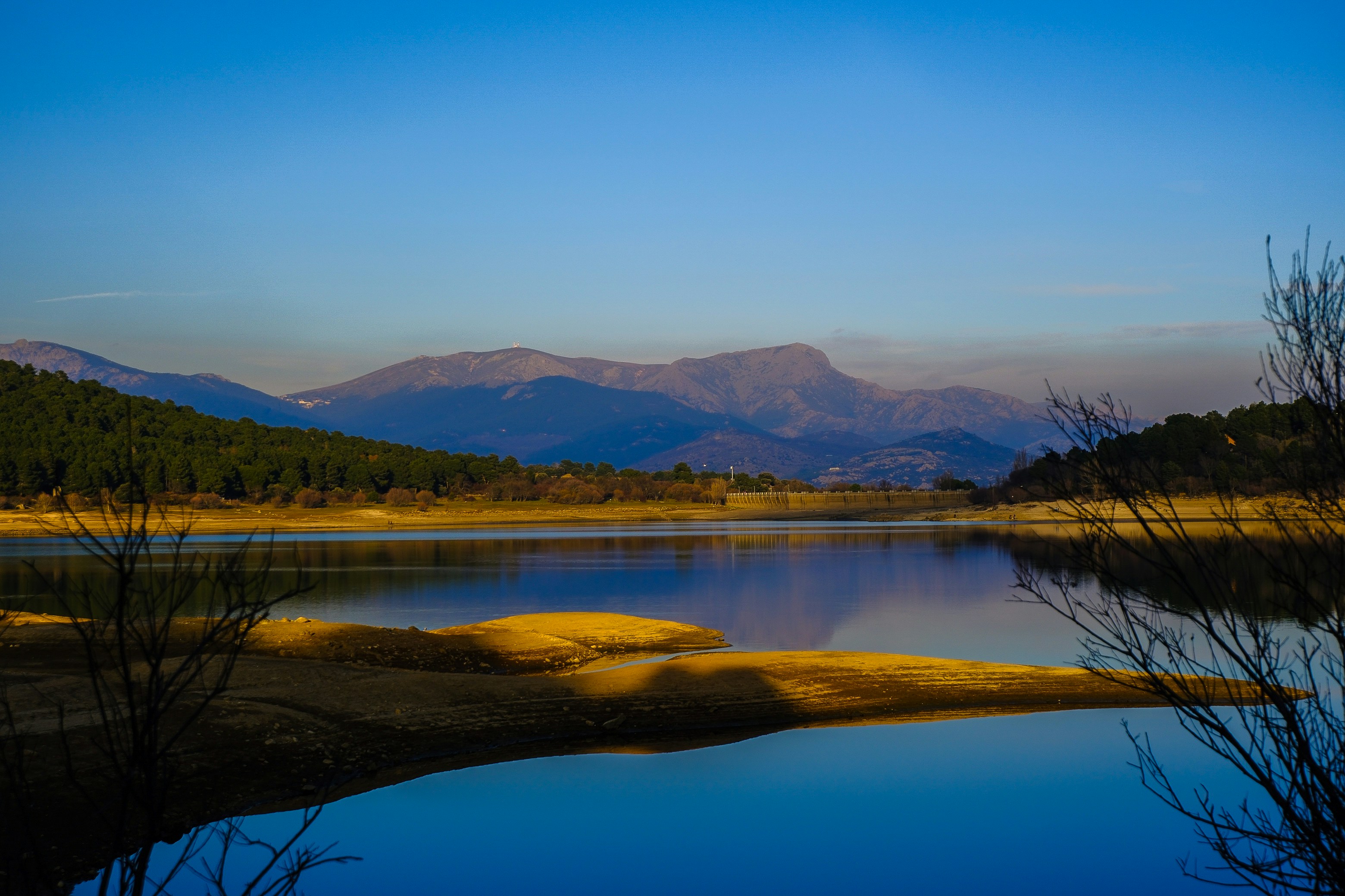 Azure Ridge Reflections over a Glassy Lake