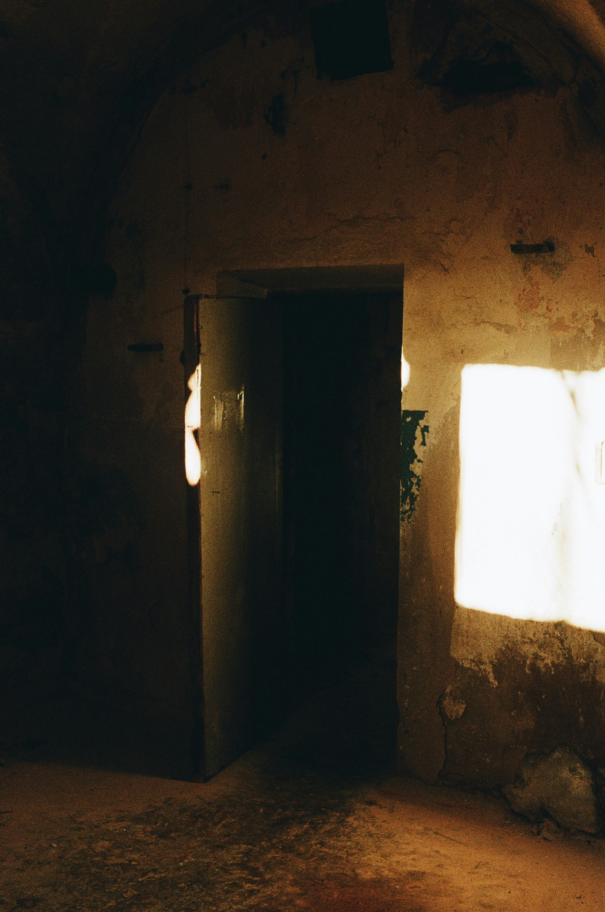 A dimly lit room with two open doors photo – Free Riga Image on Unsplash