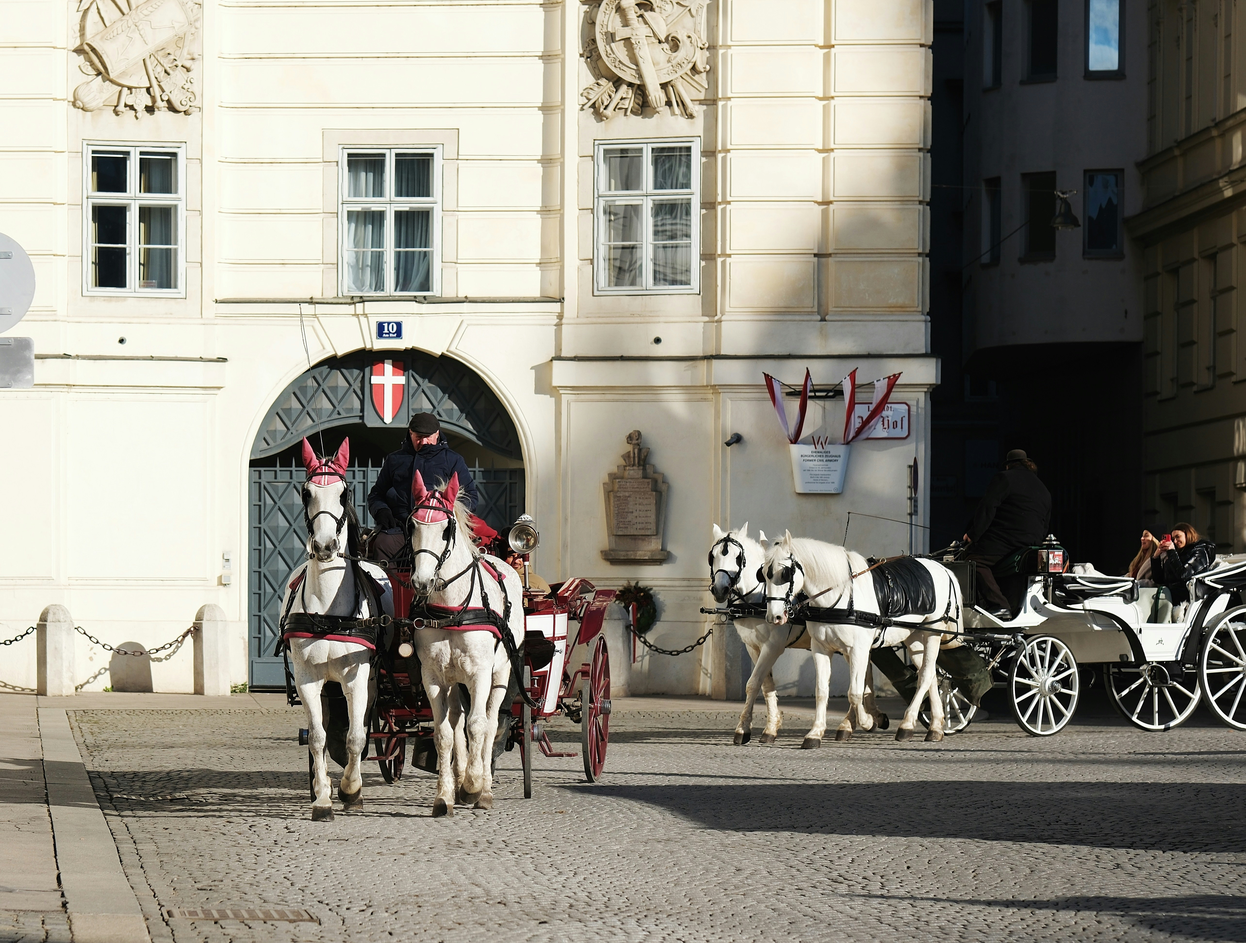 Viennese Carriages Amidst Historic Facades