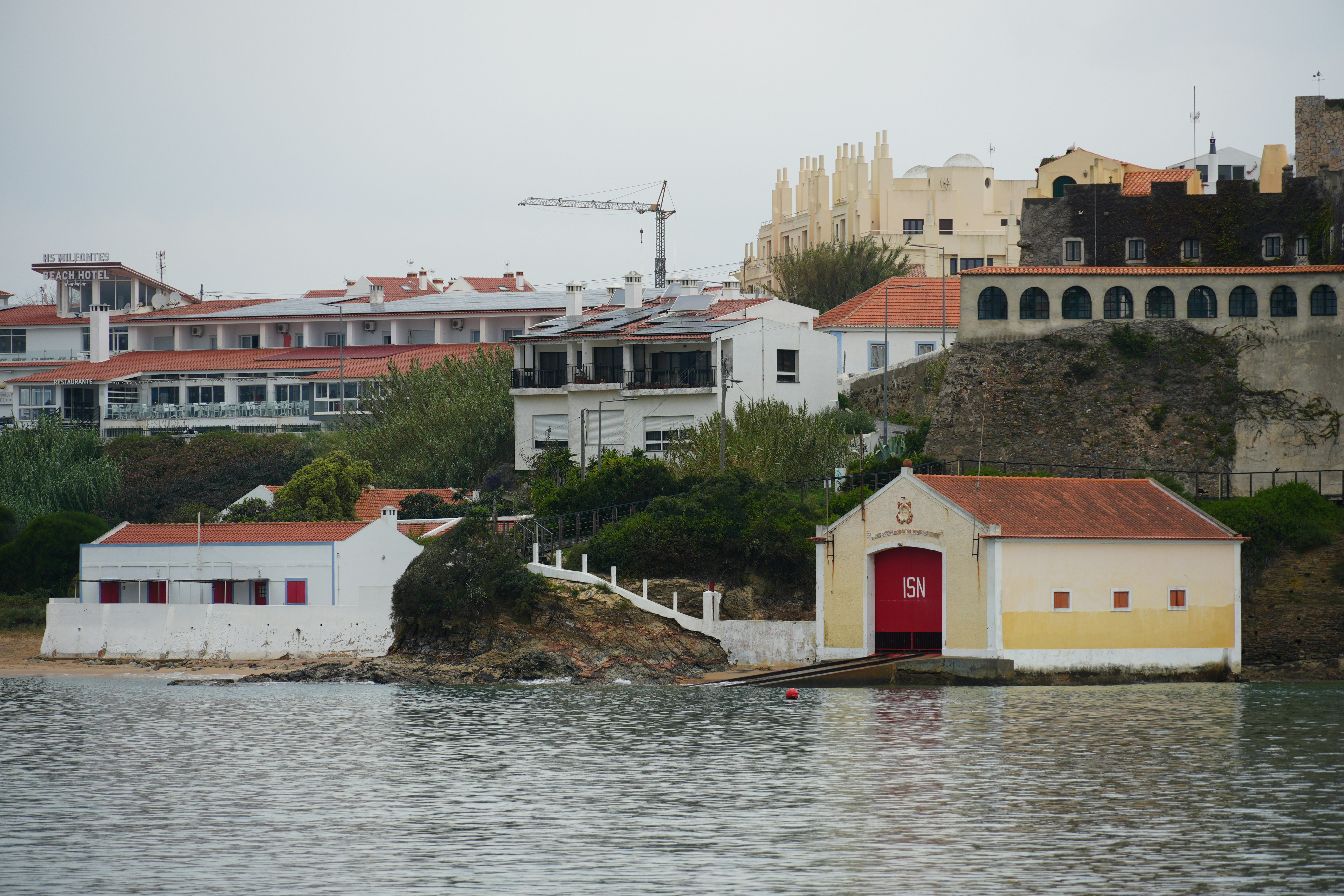 Harbor's Quiet Edge: The Yellow Boathouse and the Seaside Village