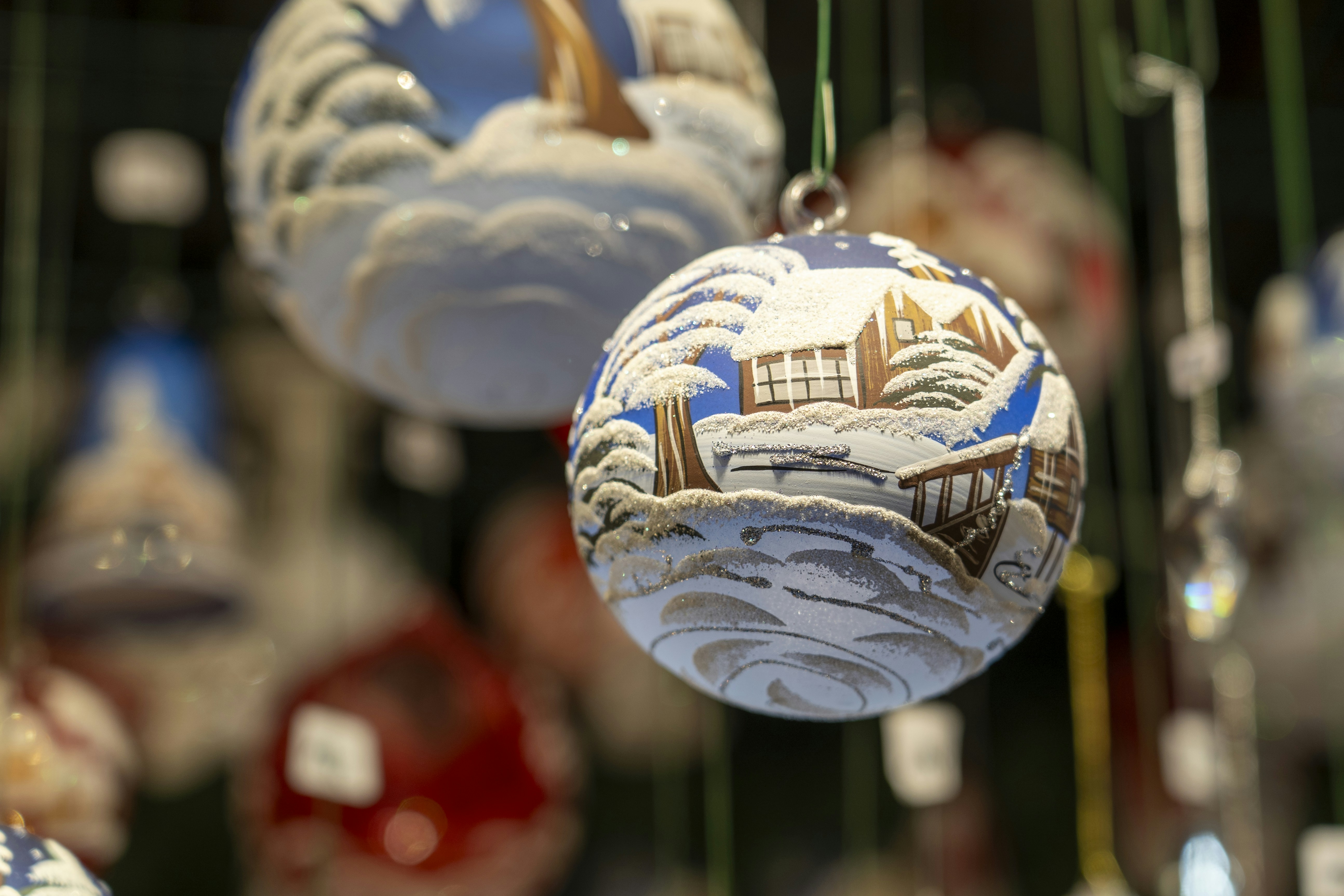 Snow-Washed Nook: A Hand-Painted Ornament in Soft Holiday Bokeh