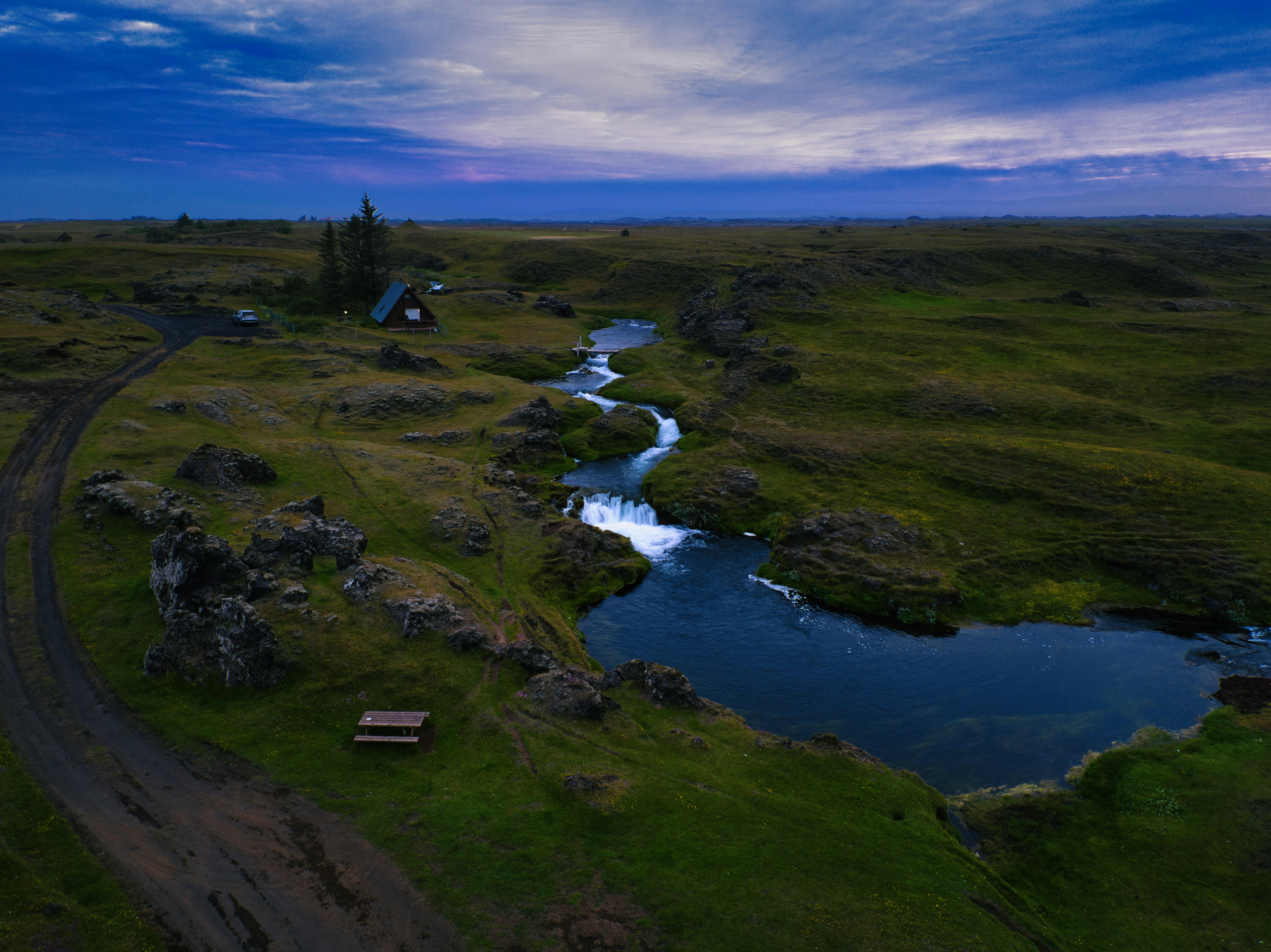 Dusk over Mossy Flats: The River's Quiet S-Curve