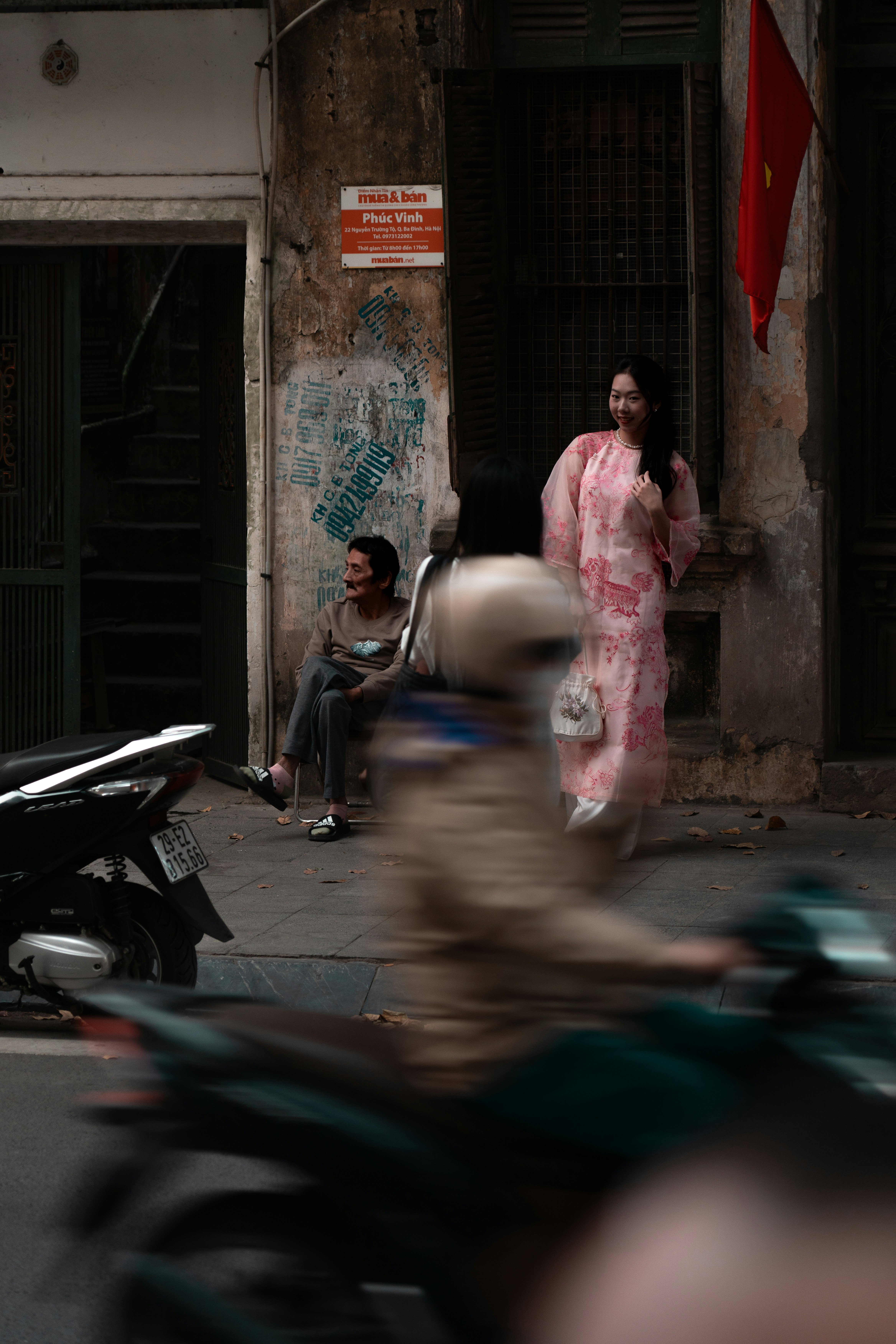 Pink Cheongsam Moment on a Quiet Vietnamese Street