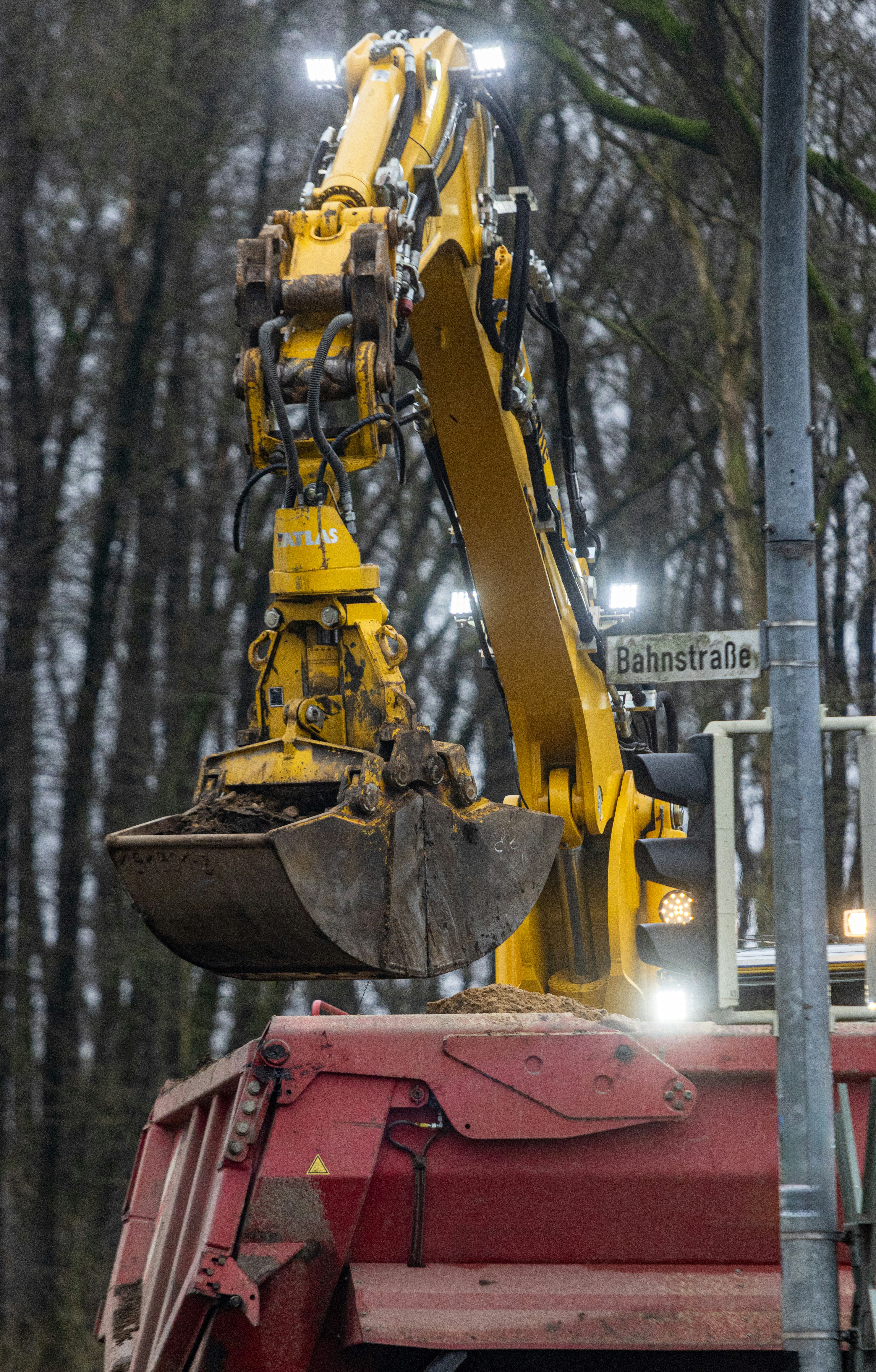 A yellow and red machine is in the middle of a forest photo – Free ...