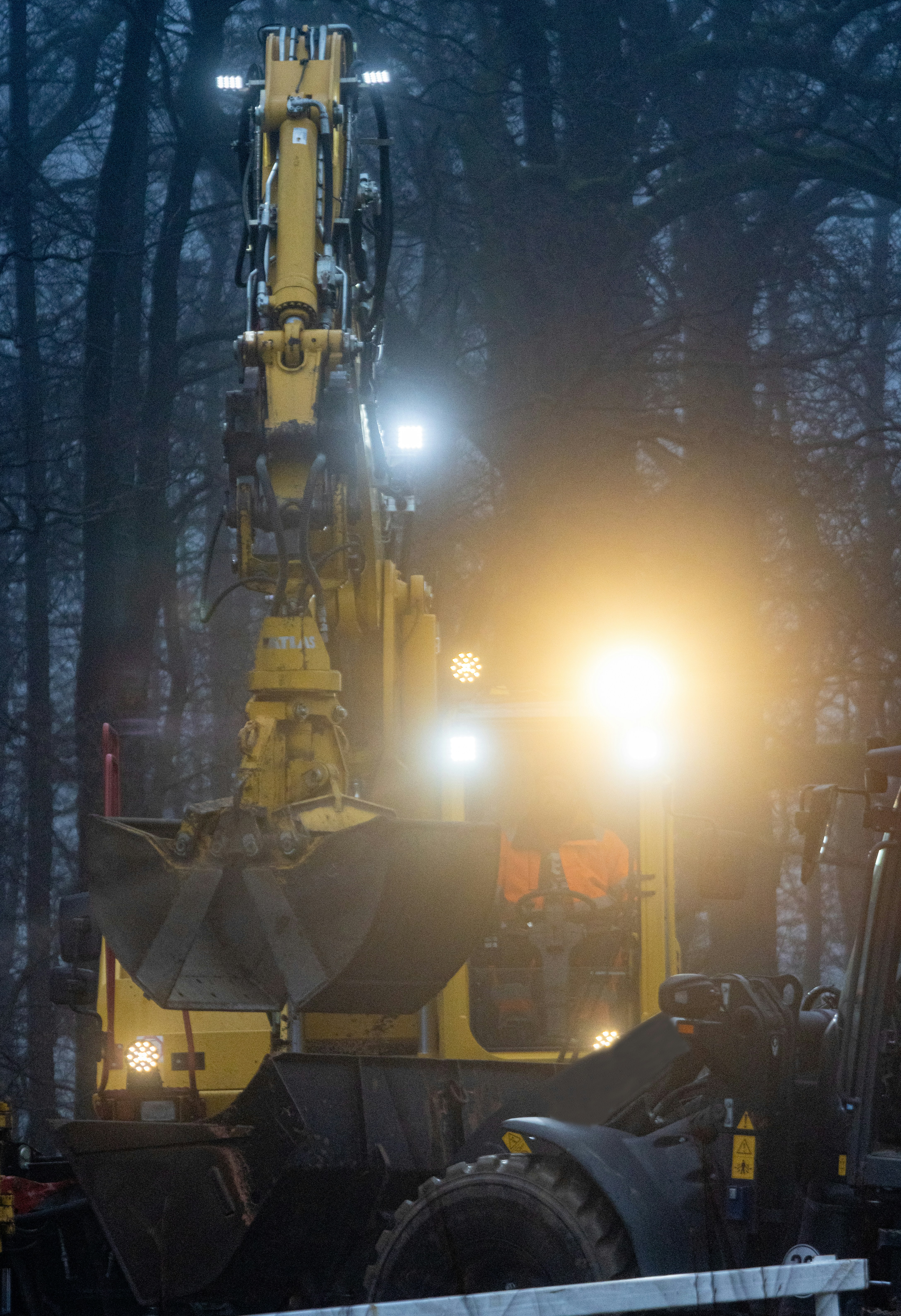 Night Ops in the Pines: The Yellow Excavator Pierces the Fog