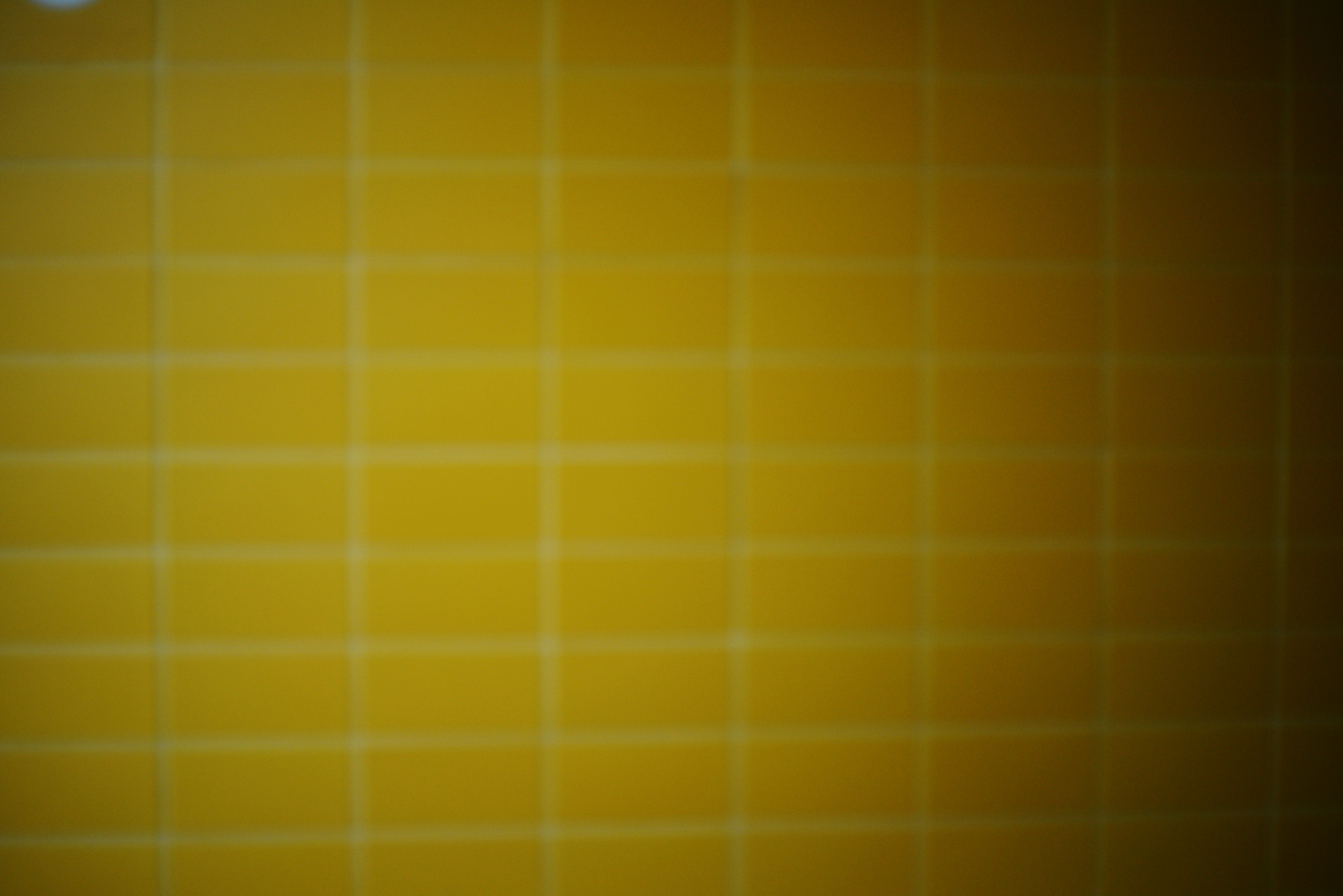 A close up of a yellow tiled wall photo – Free Image on Unsplash