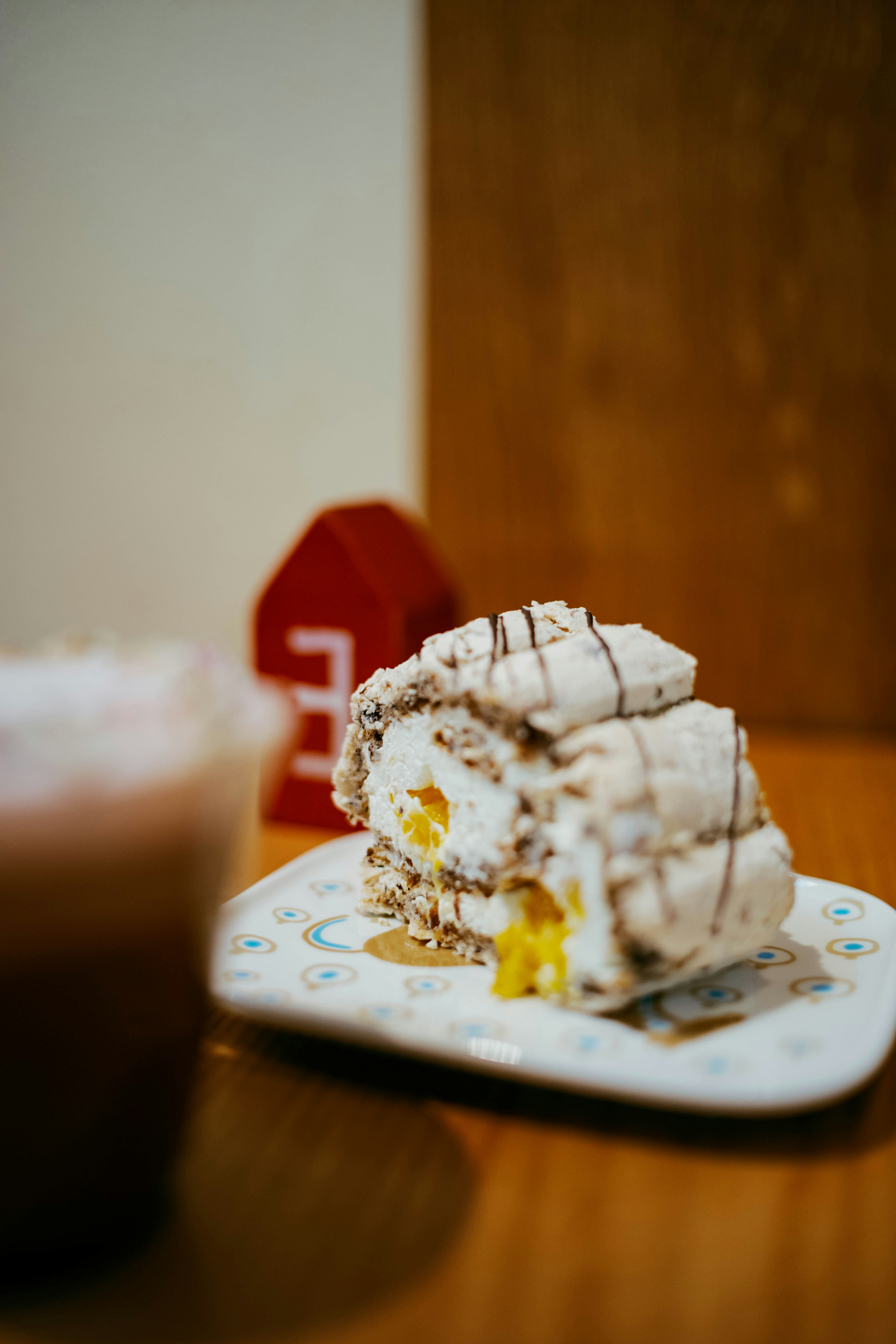 Powdered Sugar Spotlight: A Cream-Filled Roll on a Quiet Plate