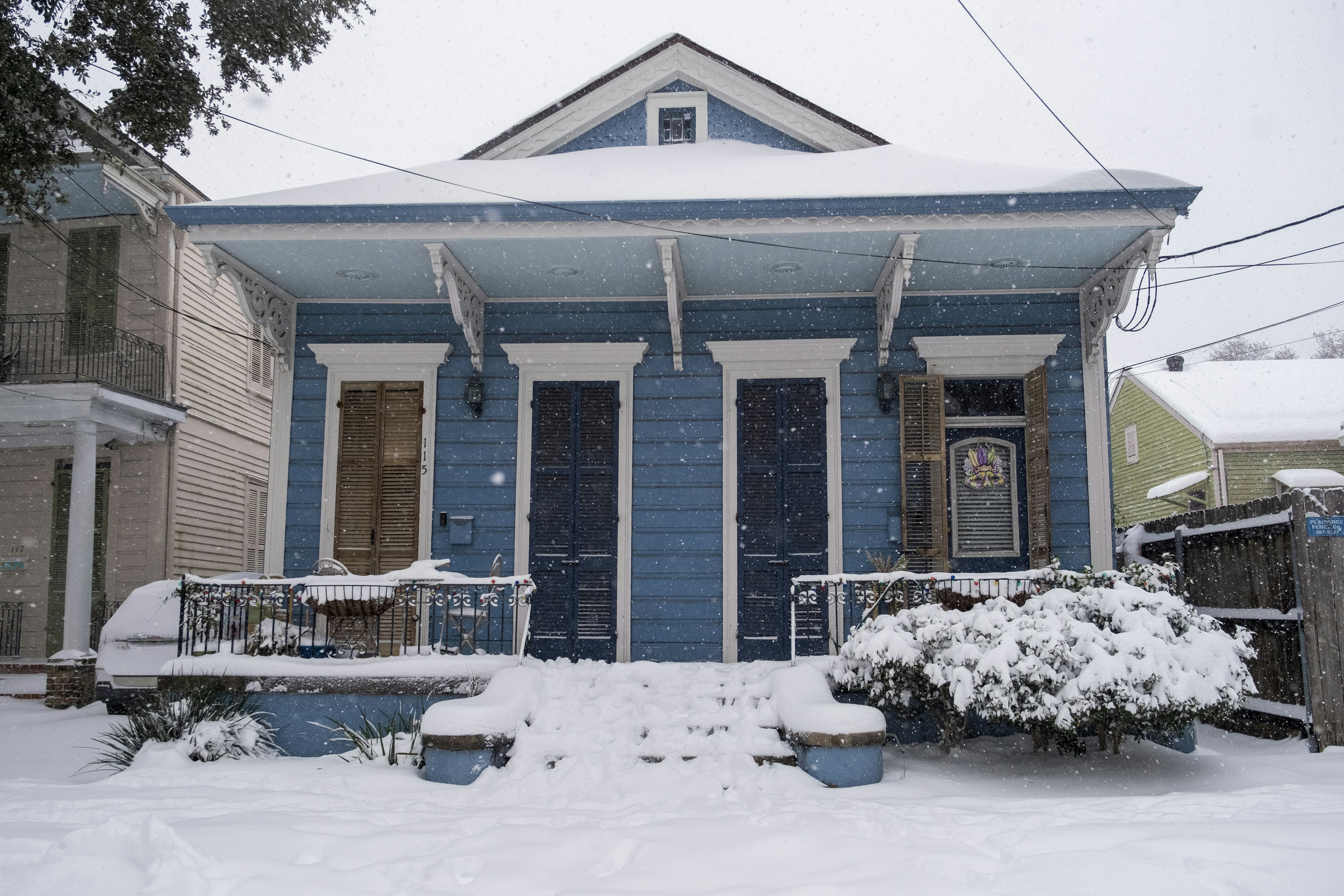 A blue house with snow on the ground photo – Free New orleans Image on ...
