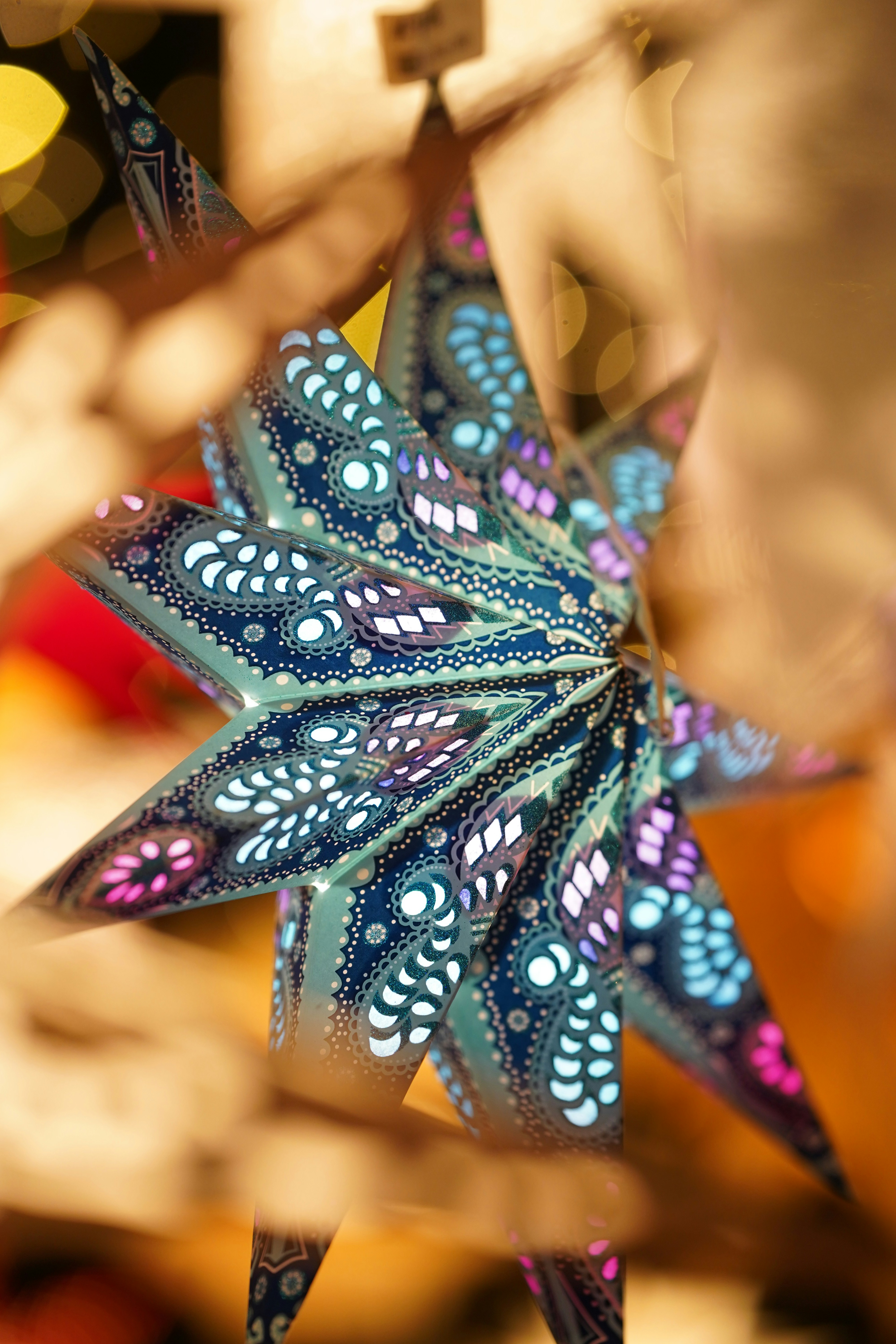 Blue-Teal Origami Star: Patterns in a Cozy Bokeh