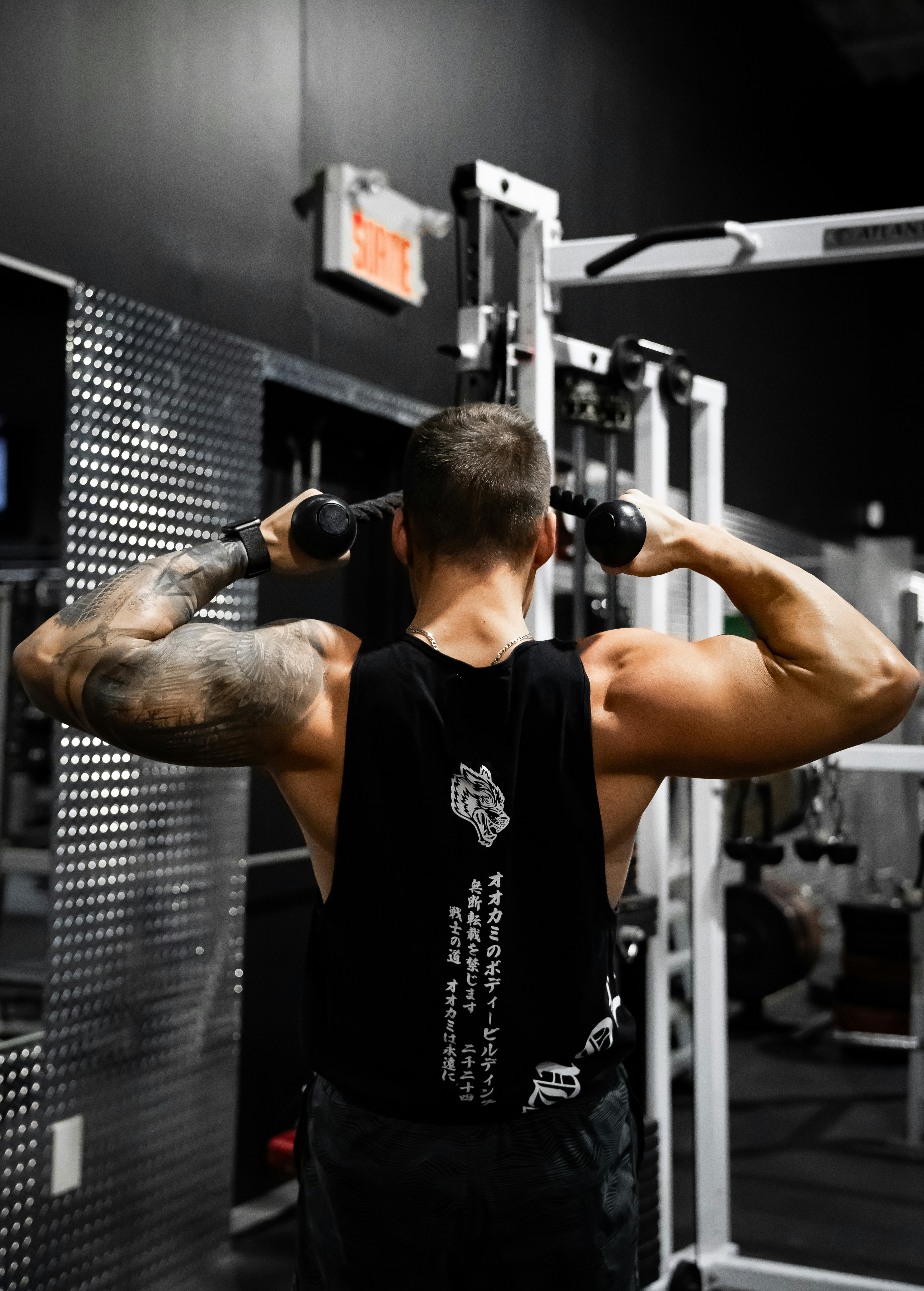 A man in a gym lifting a barbell photo – Free Mace club Image on Unsplash