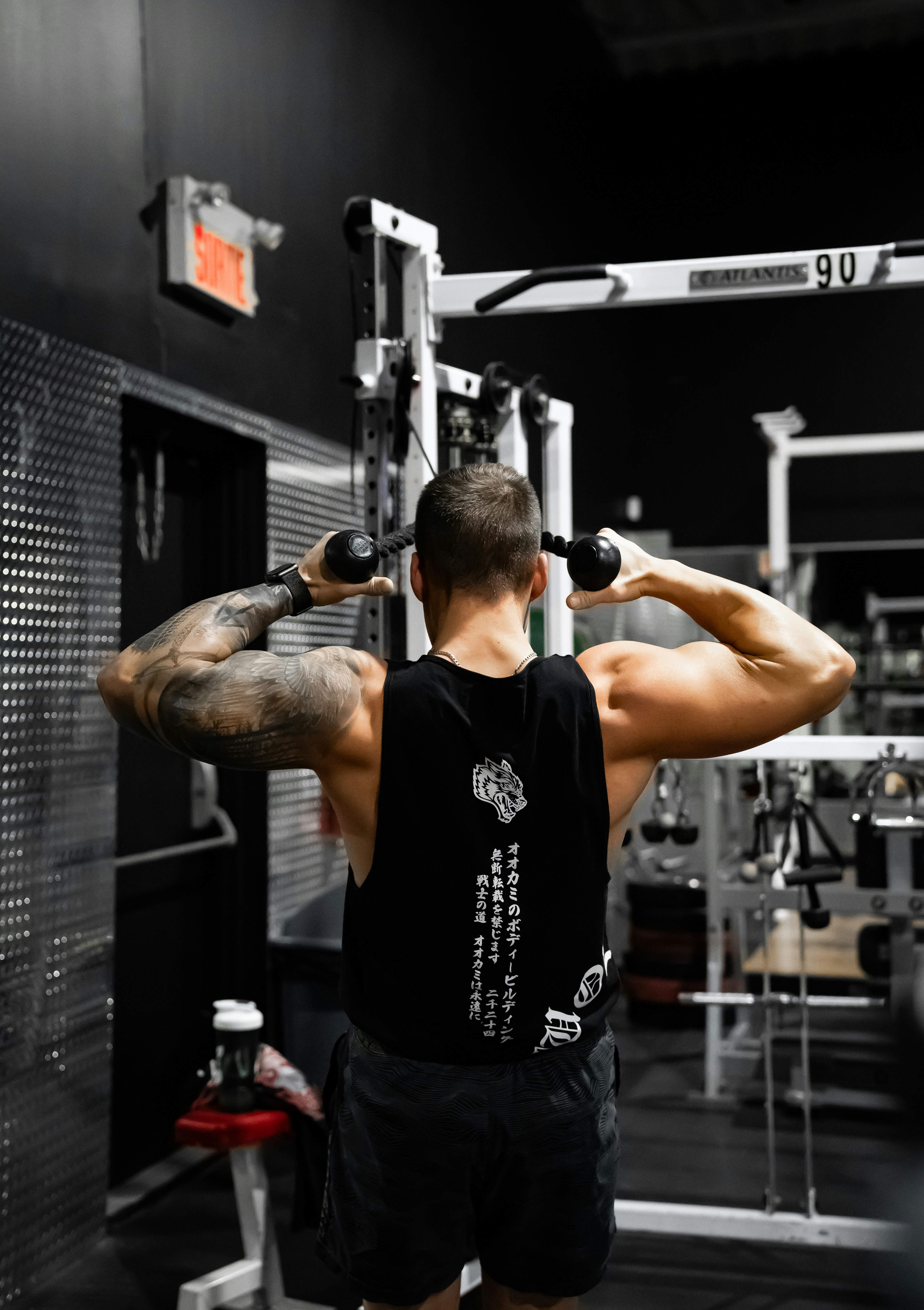 A man in a gym lifting a barbell photo – Free Mace club Image on Unsplash