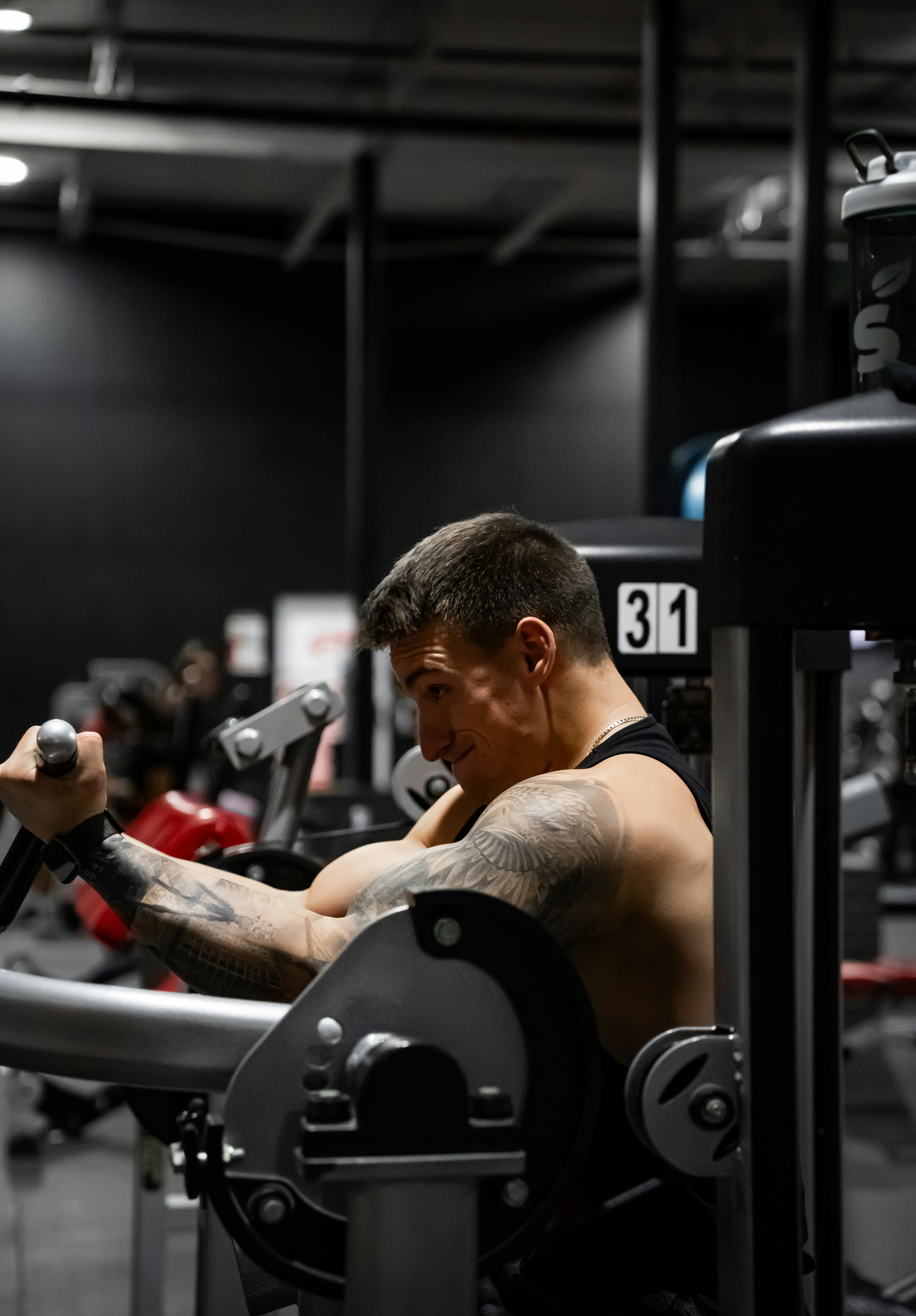 A man working out with a barbell in a gym photo – Free Man Image on ...