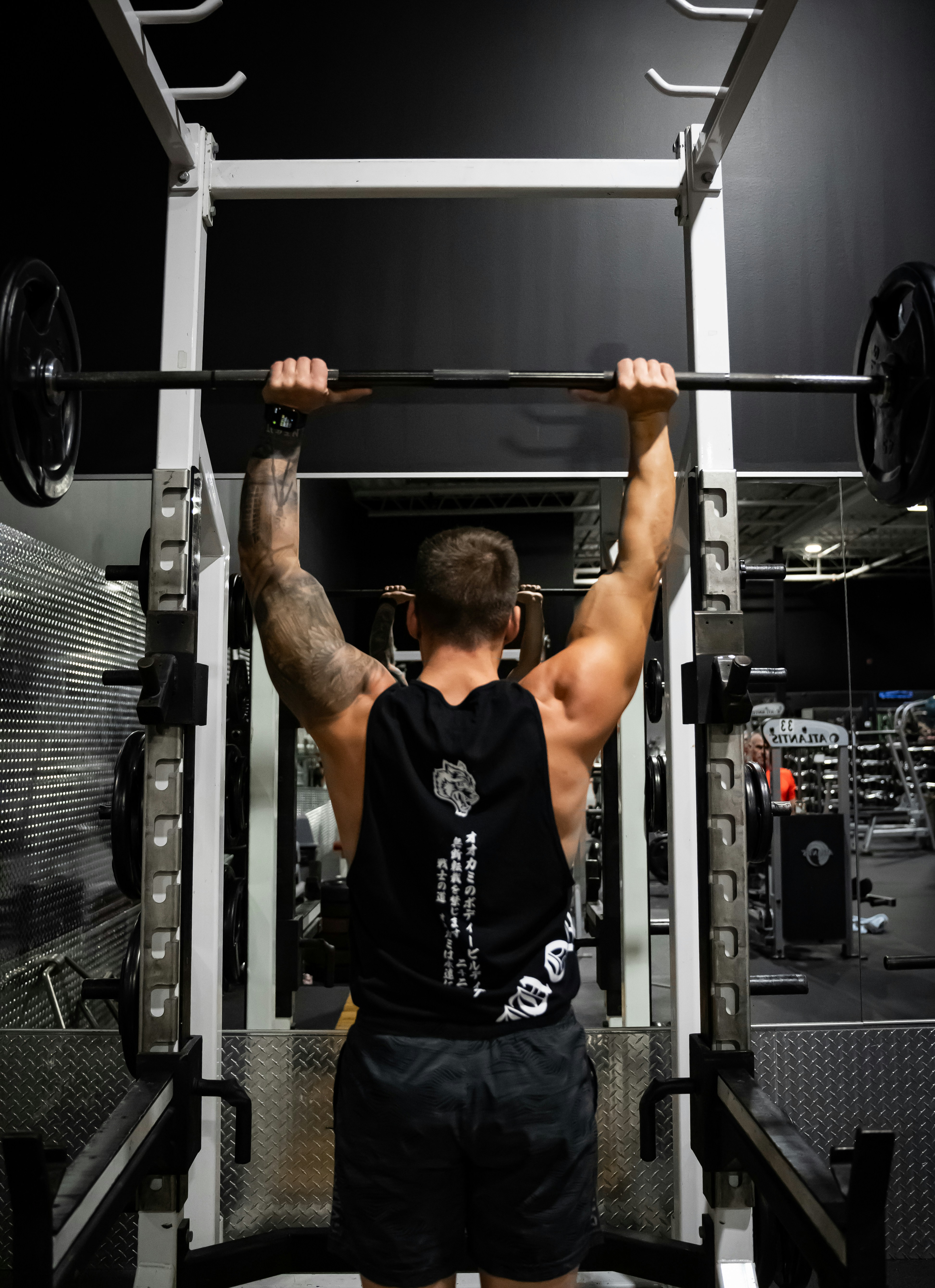 A man in a gym lifting a barbell photo – Free Human Image on Unsplash