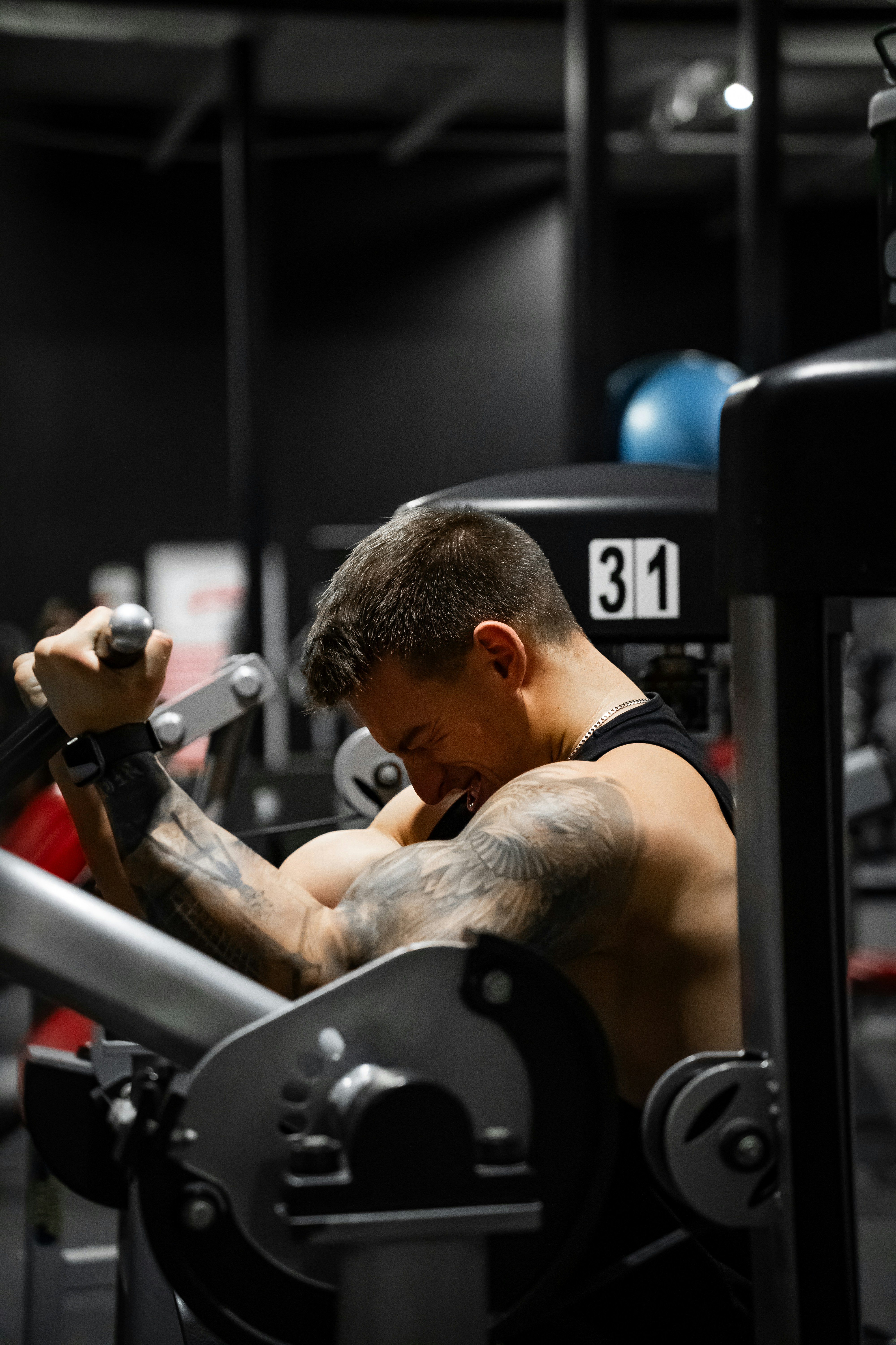 A man working out with a barbell in a gym photo – Free Man Image on ...