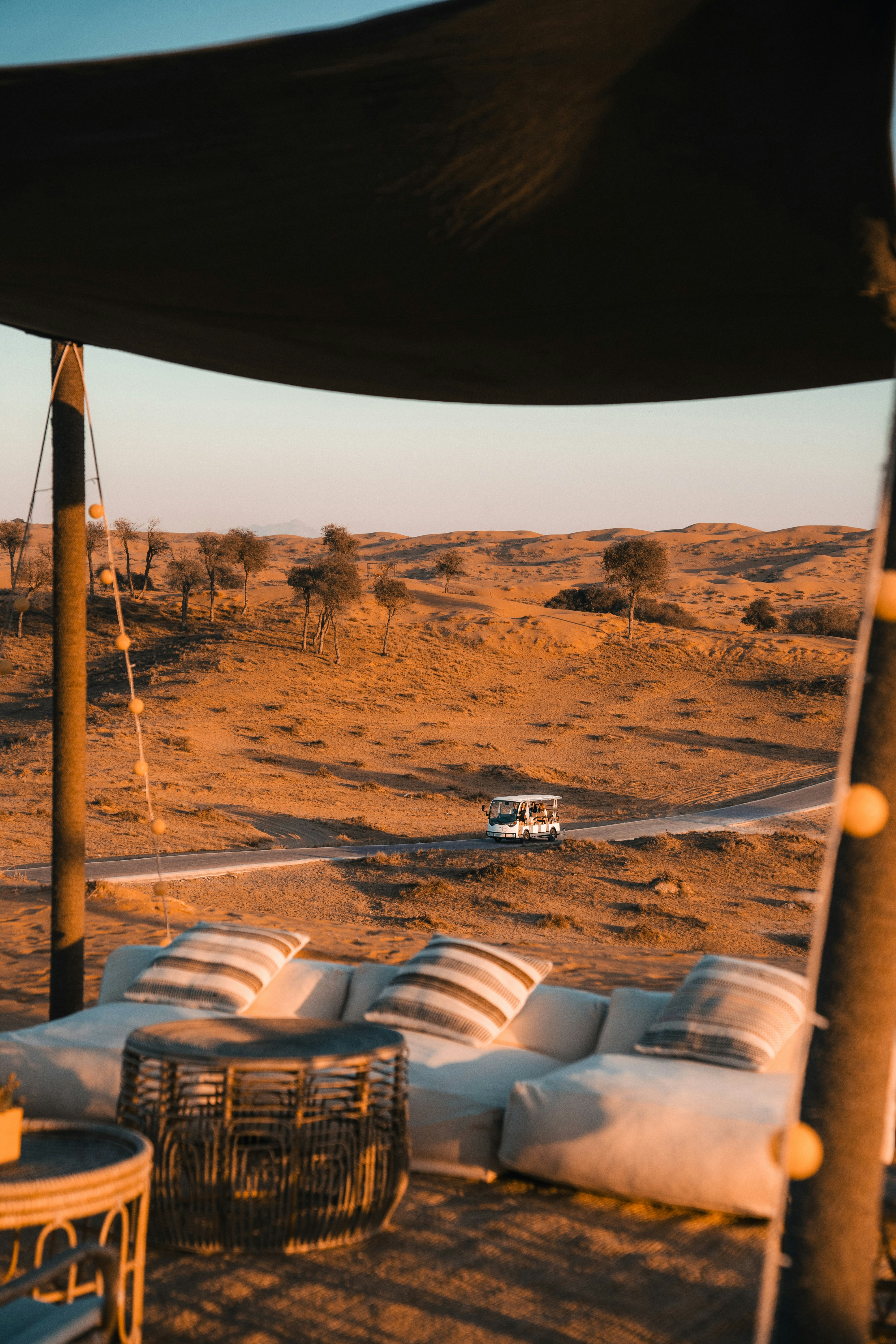 Golden Hour Oasis: Lounge Terrace Framing a Desert Road