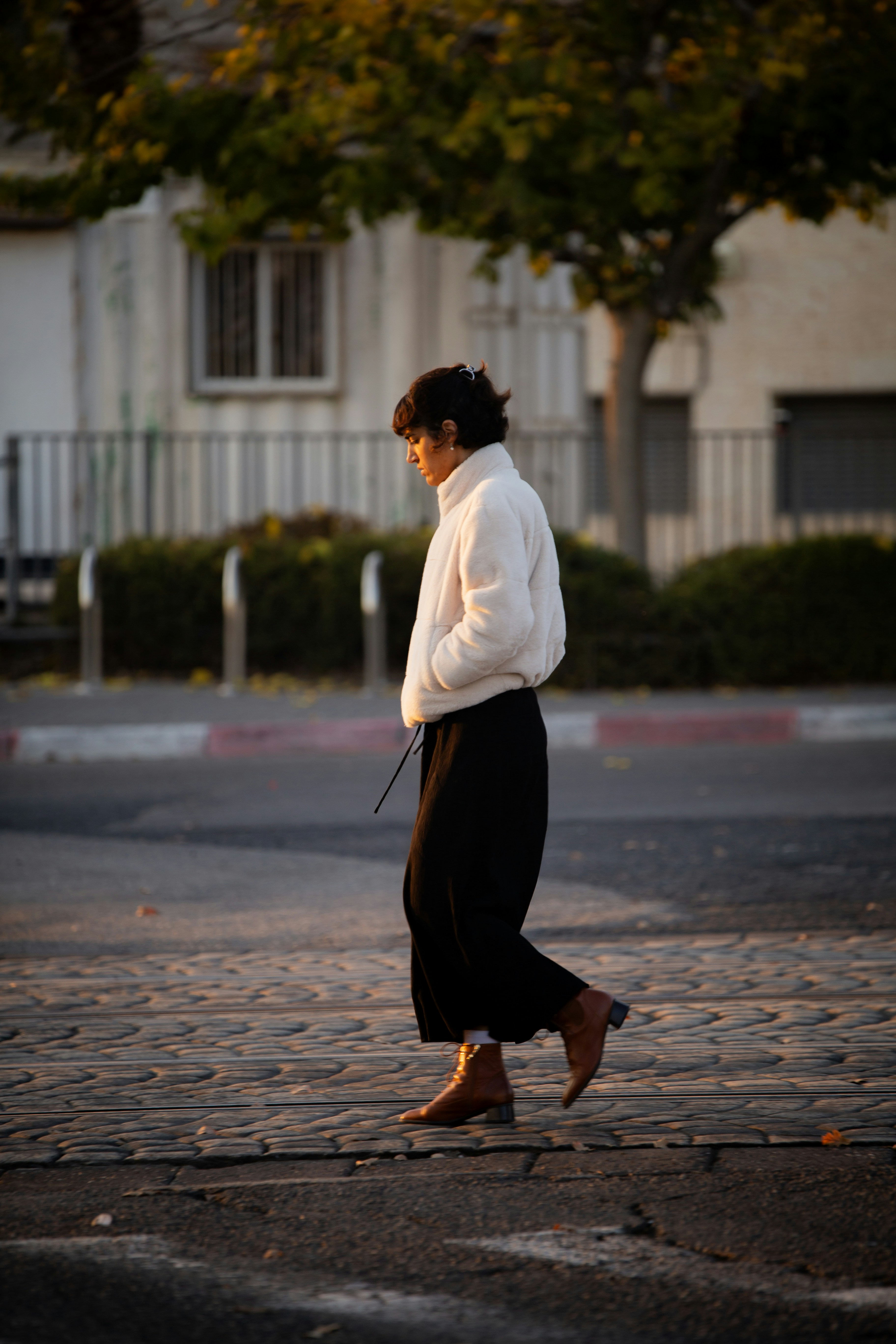 Silhouette of a Quiet Walk: Autumn Street Fire in Warm Evening Light
