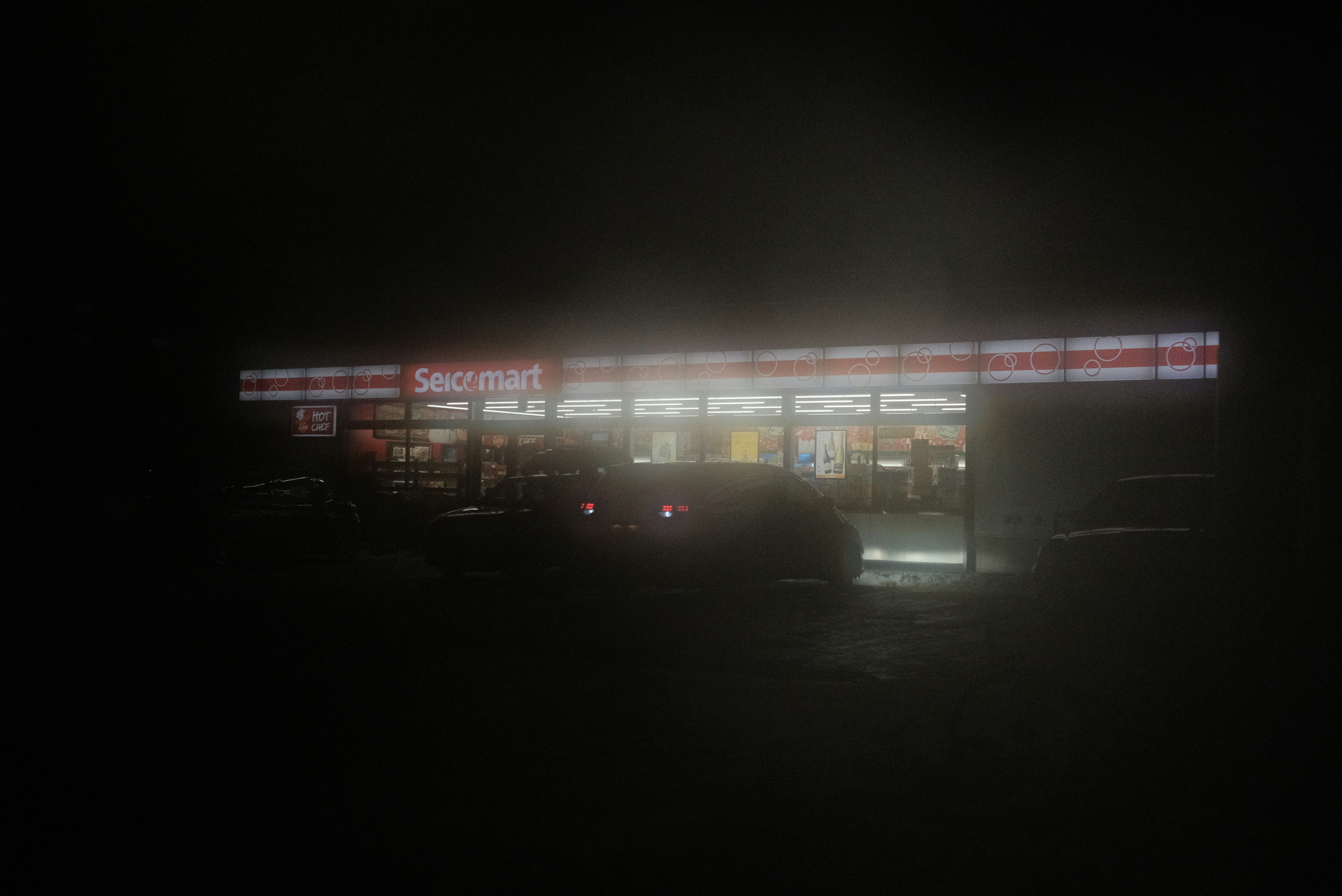 A building lit up at night in the dark