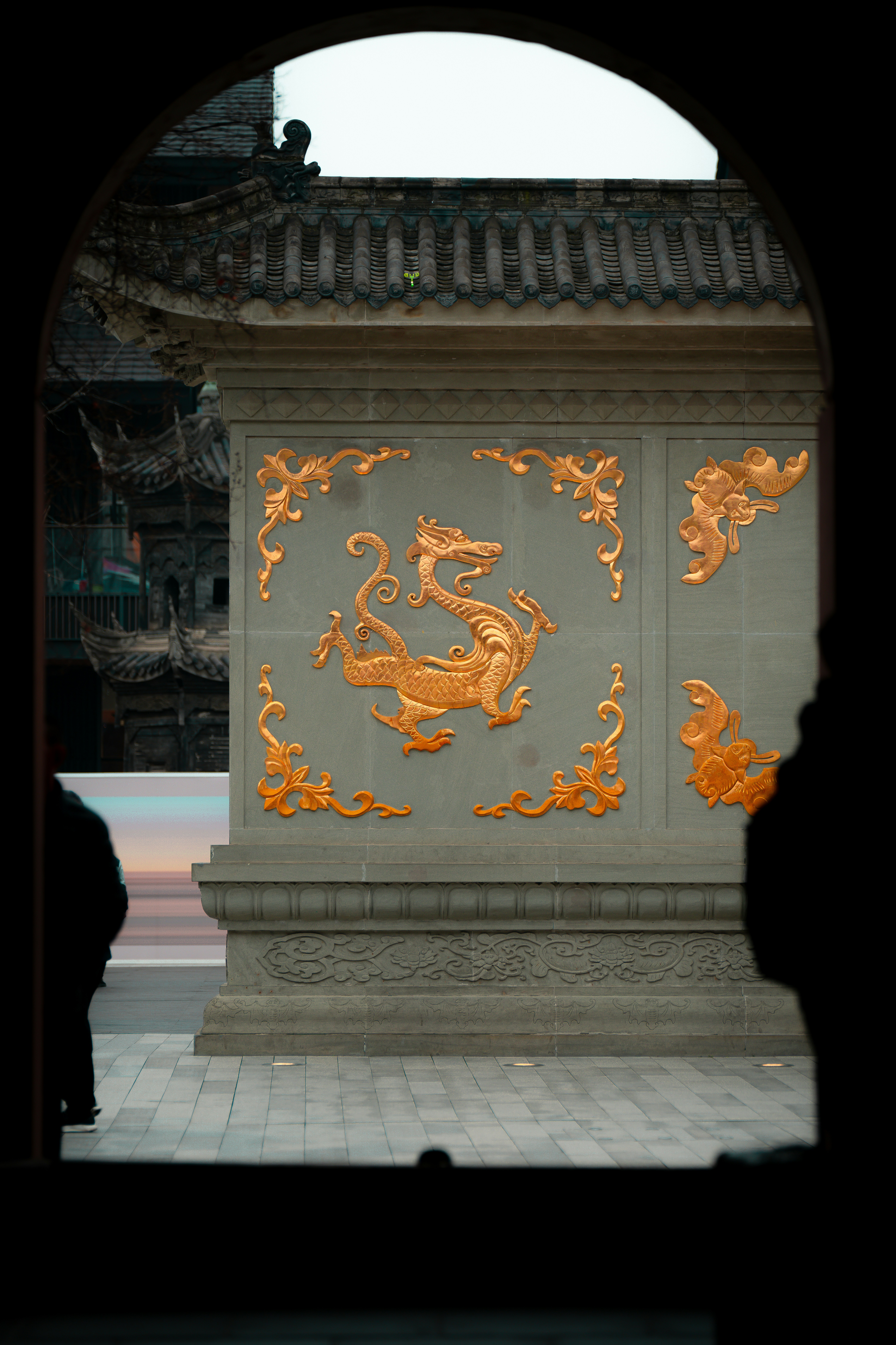 Dragon Crest in a Shadowed Archway