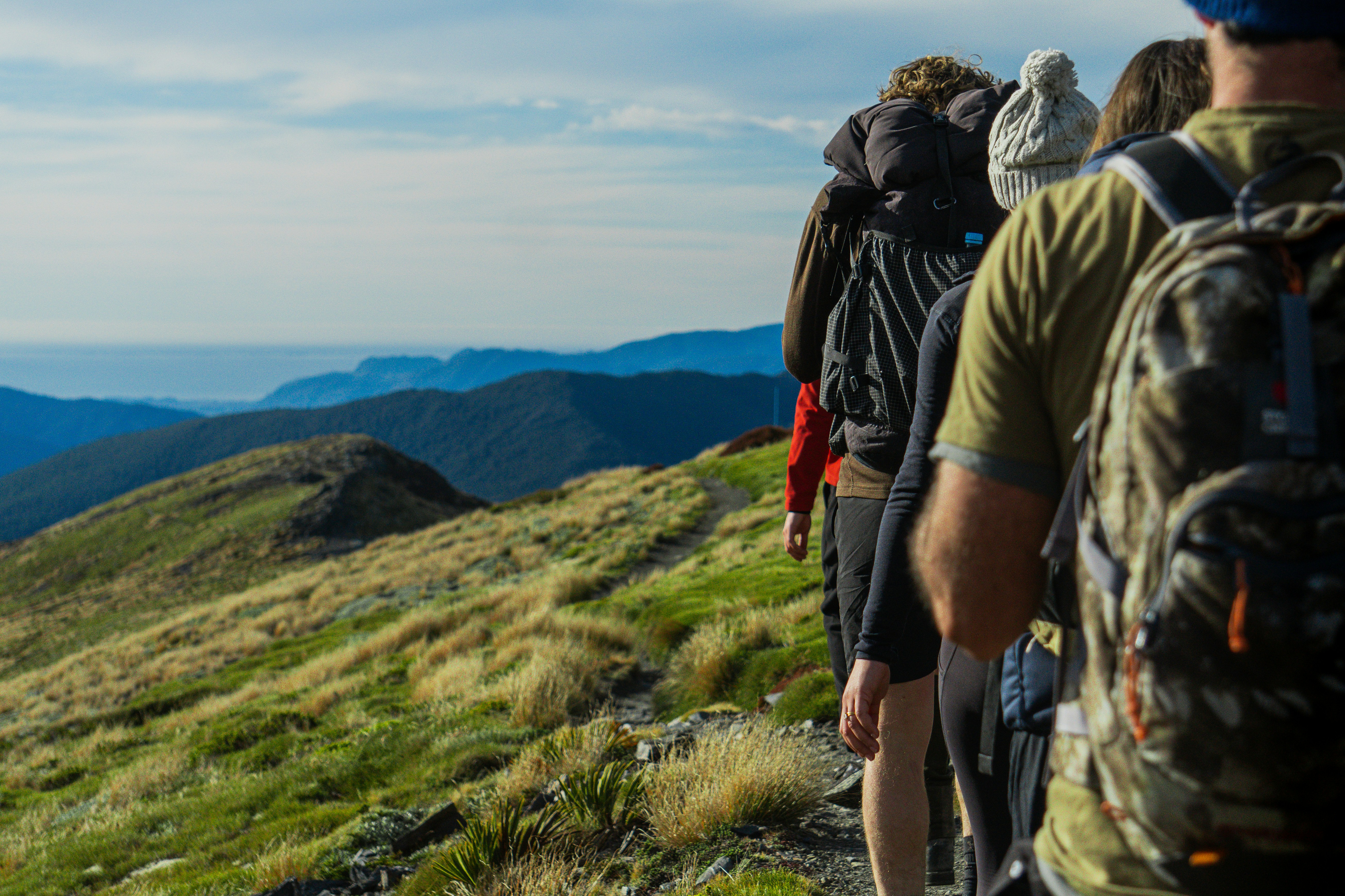 A group of people hiking up a hill photo – Free Adventure Image on Unsplash