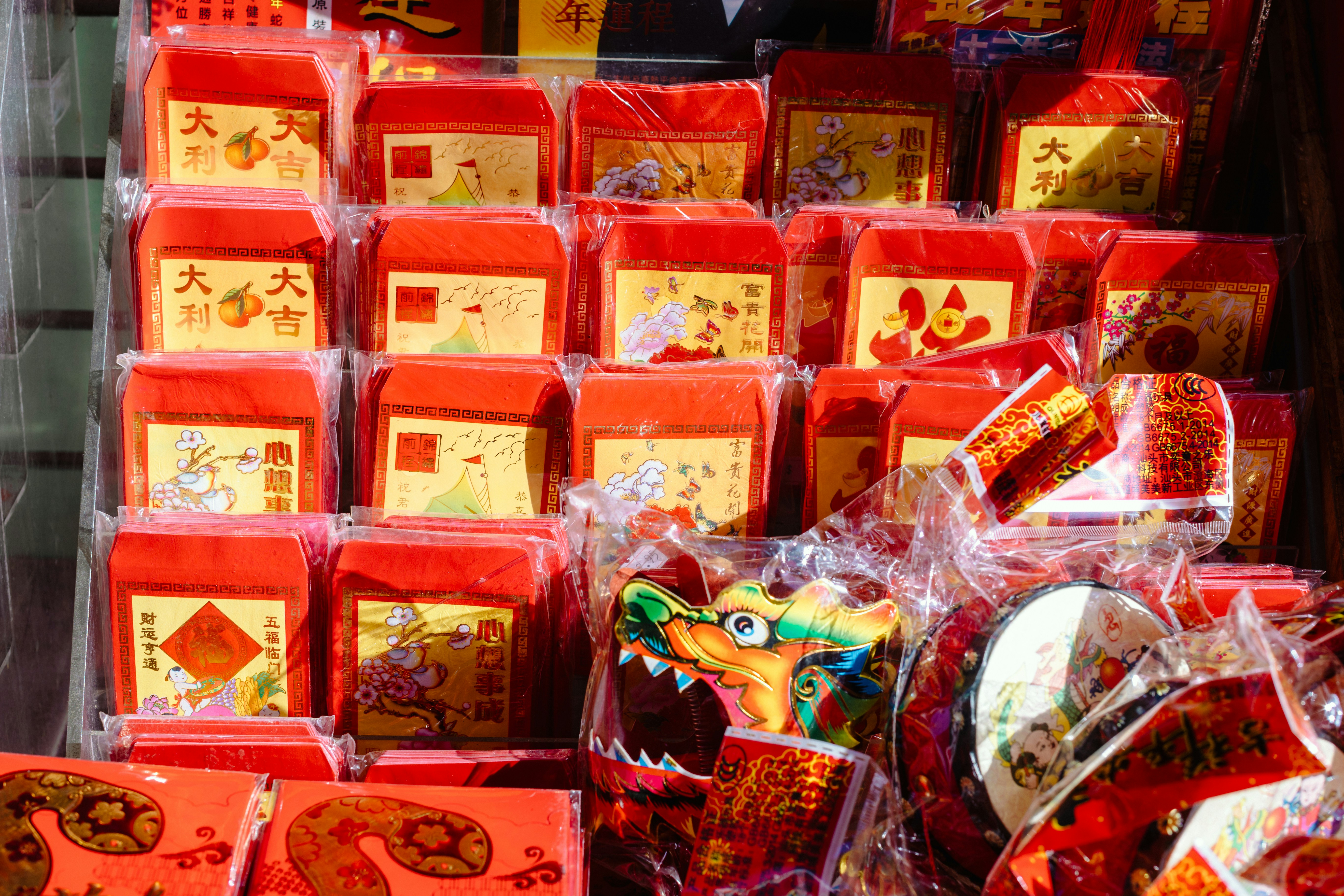 Dragon's Gilded Row: Red Envelopes Framing a Lunar Market Stall